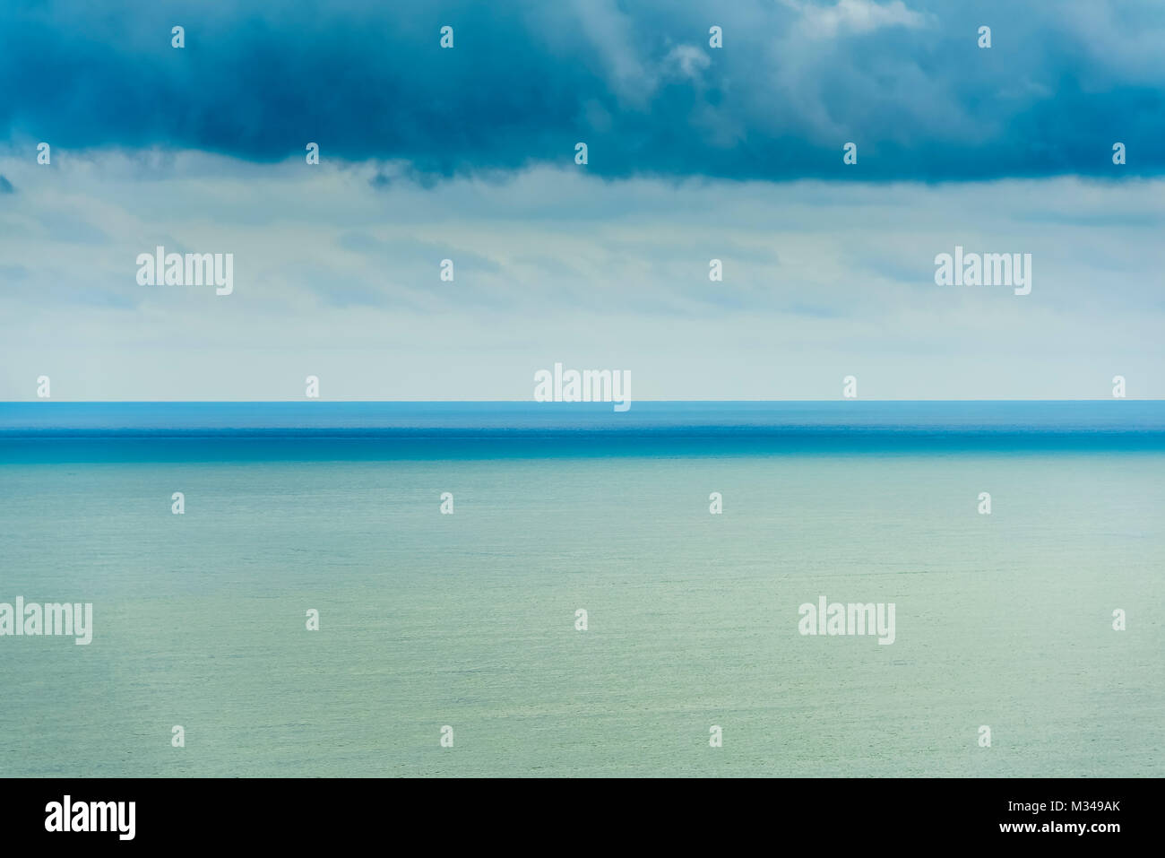 A calming, relaxing seascape oceanscape sunset showing a blue sea, blue ...