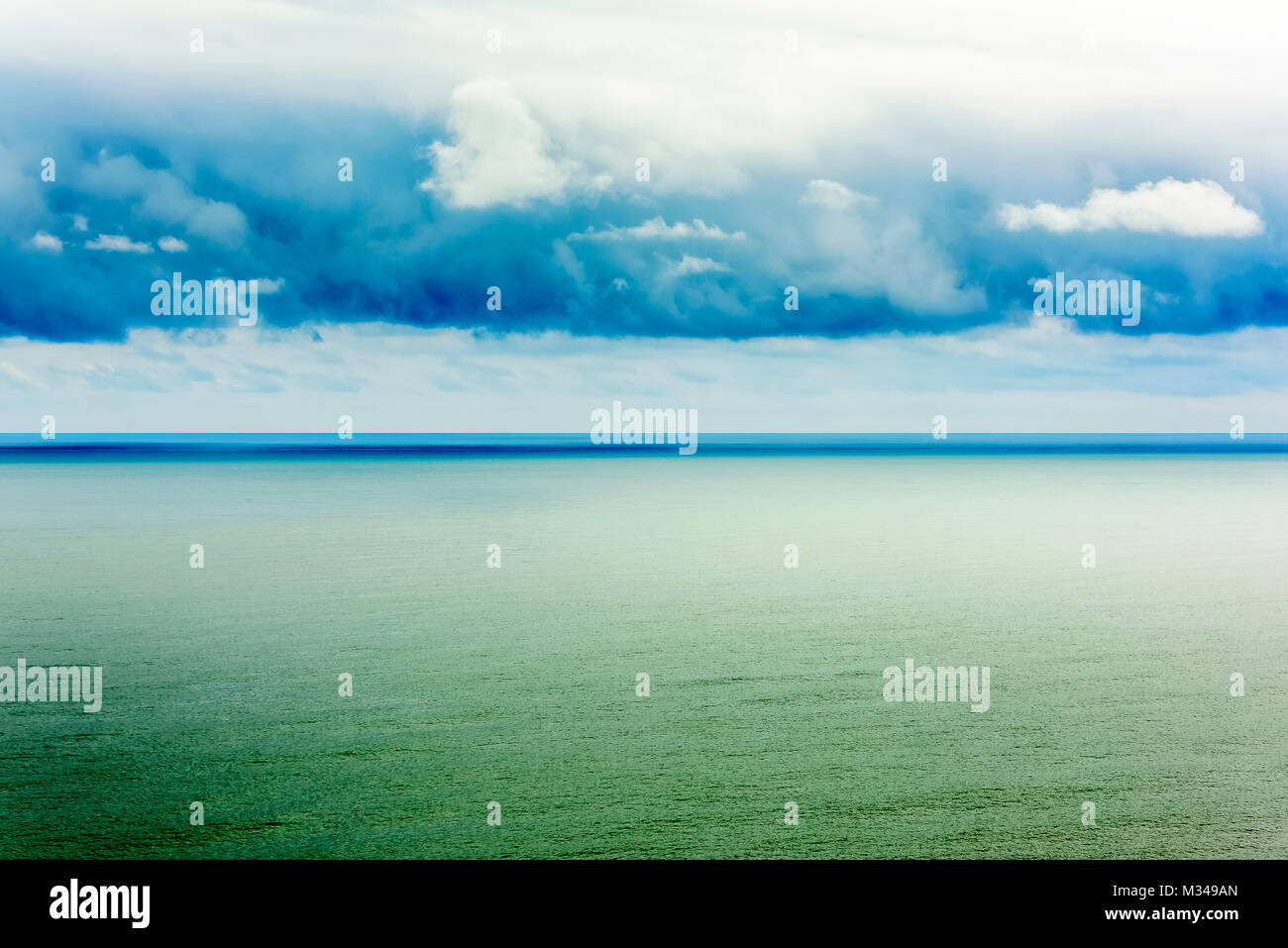 A calming, relaxing seascape oceanscape sunset showing a blue sea, blue ...