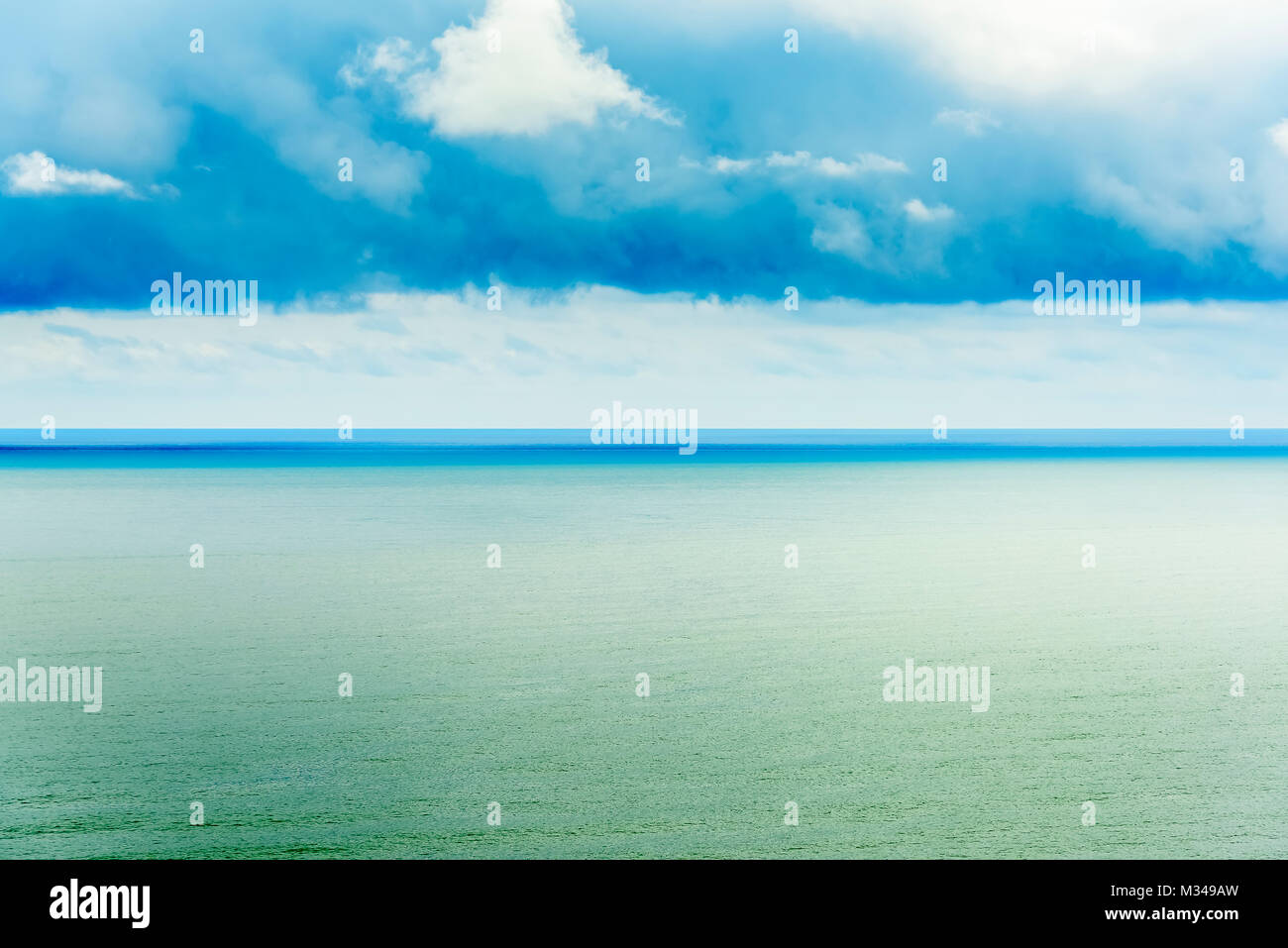 A calming, relaxing seascape oceanscape sunset showing a blue sea, blue ...