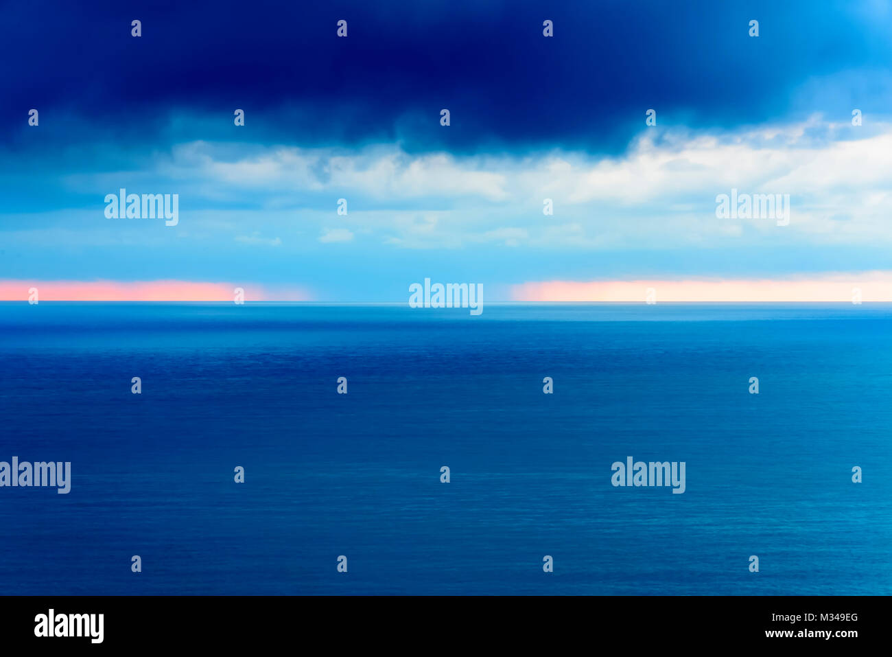 A calming, relaxing seascape oceanscape sunset showing a blue sea, blue ...