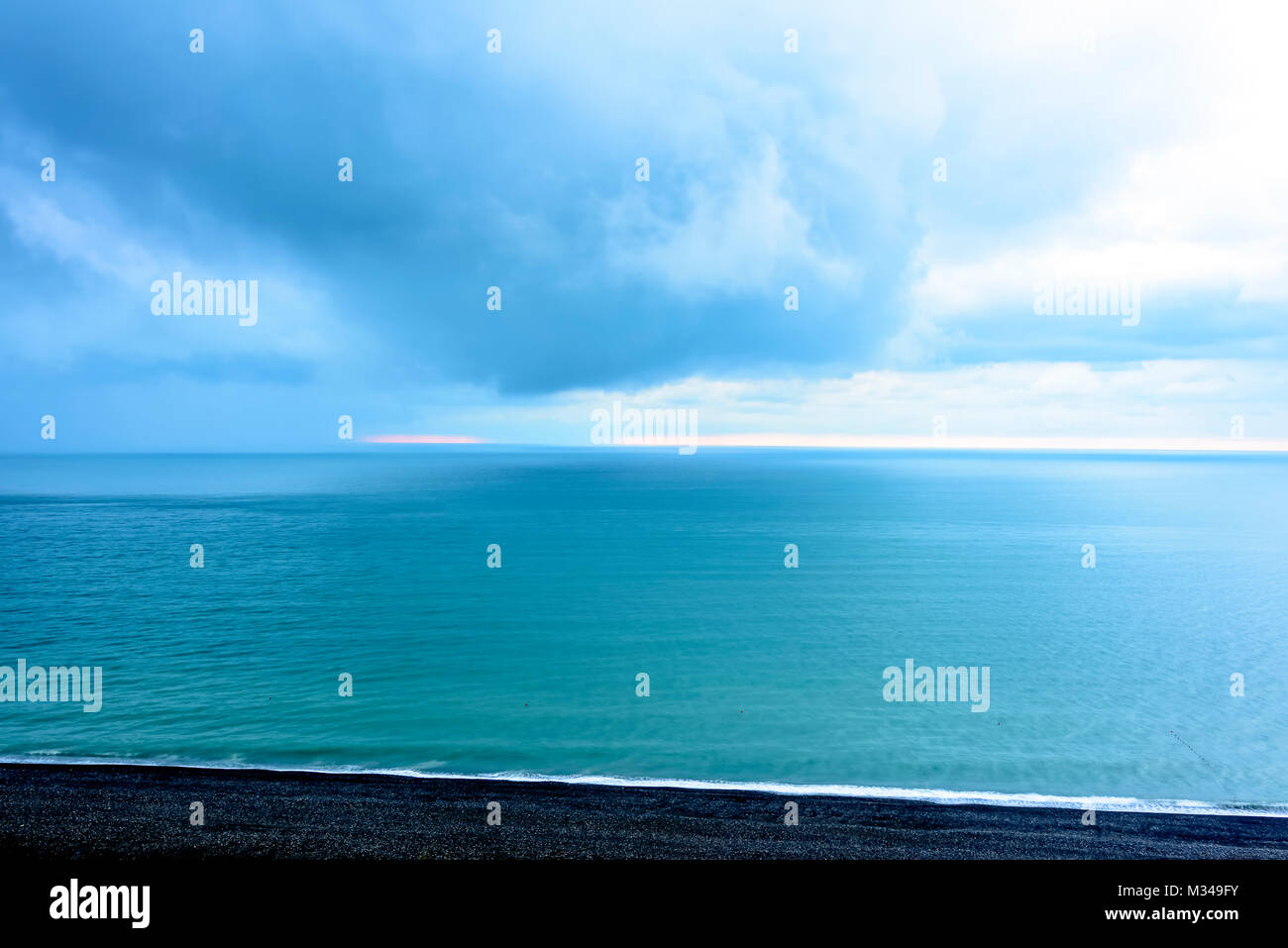 A calming, relaxing seascape oceanscape sunset showing a blue sea, blue ...