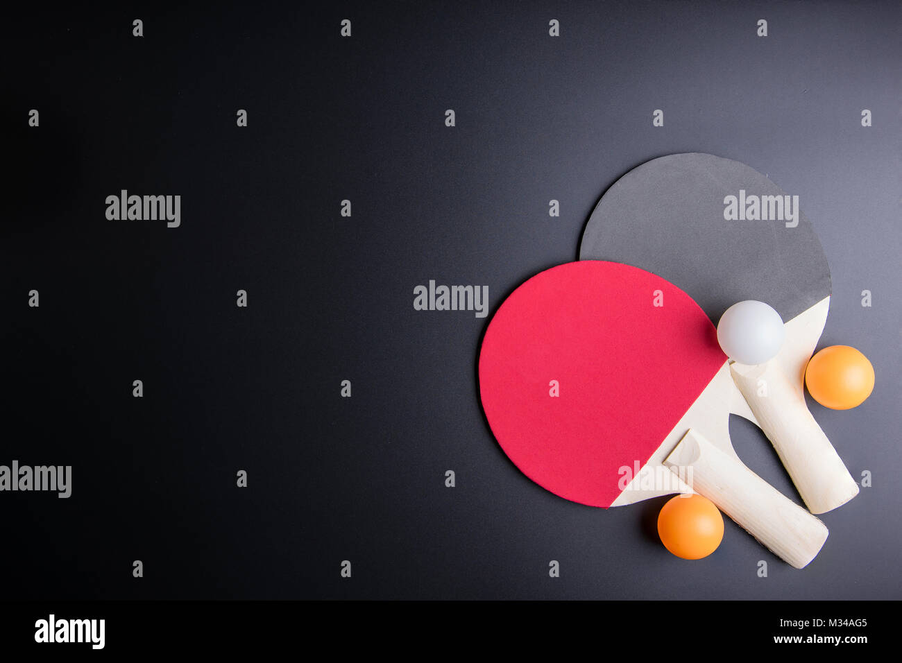 Racket table tennis with ping pong ball on black background.Sport ...
