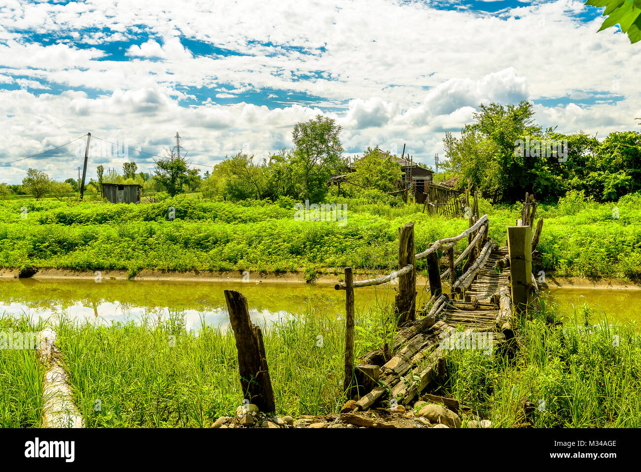 Old wooden bridge over a small river in a Georgian village Stock Photo ...