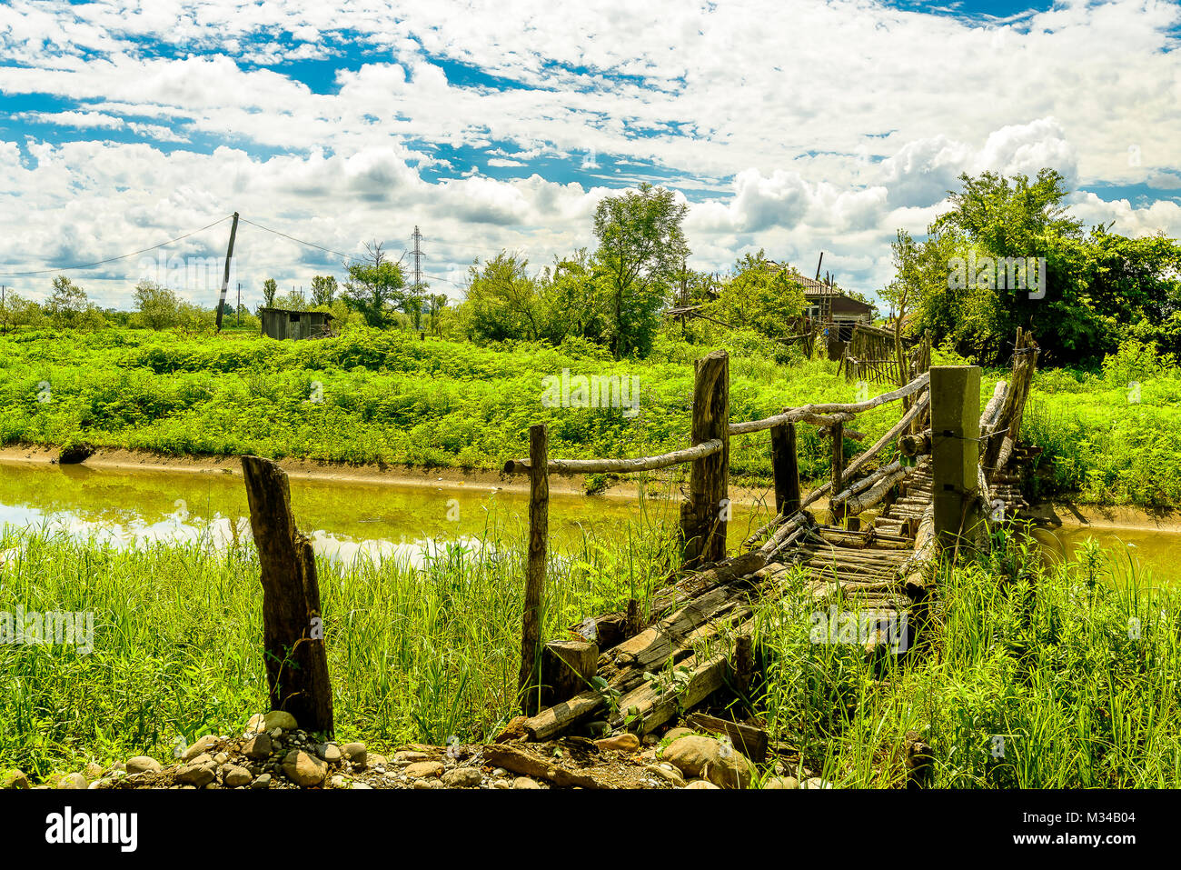 Old wooden bridge over a small river in a Georgian village Stock Photo ...