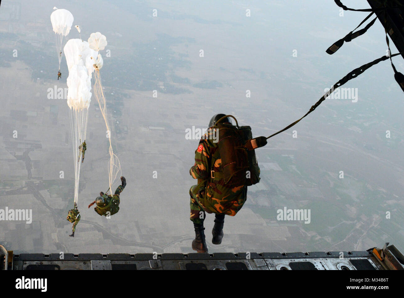 Bangladeshi commandos jump from a U.S. Air Force C-130H aircraft over a ...