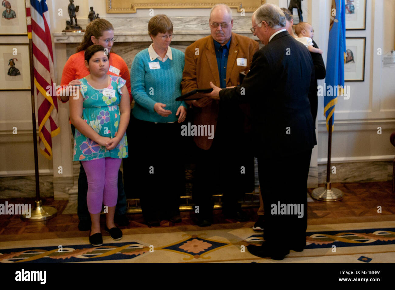 Oklahoma State Senator John Ford presents the Oklahoma Gold Star Medal ...