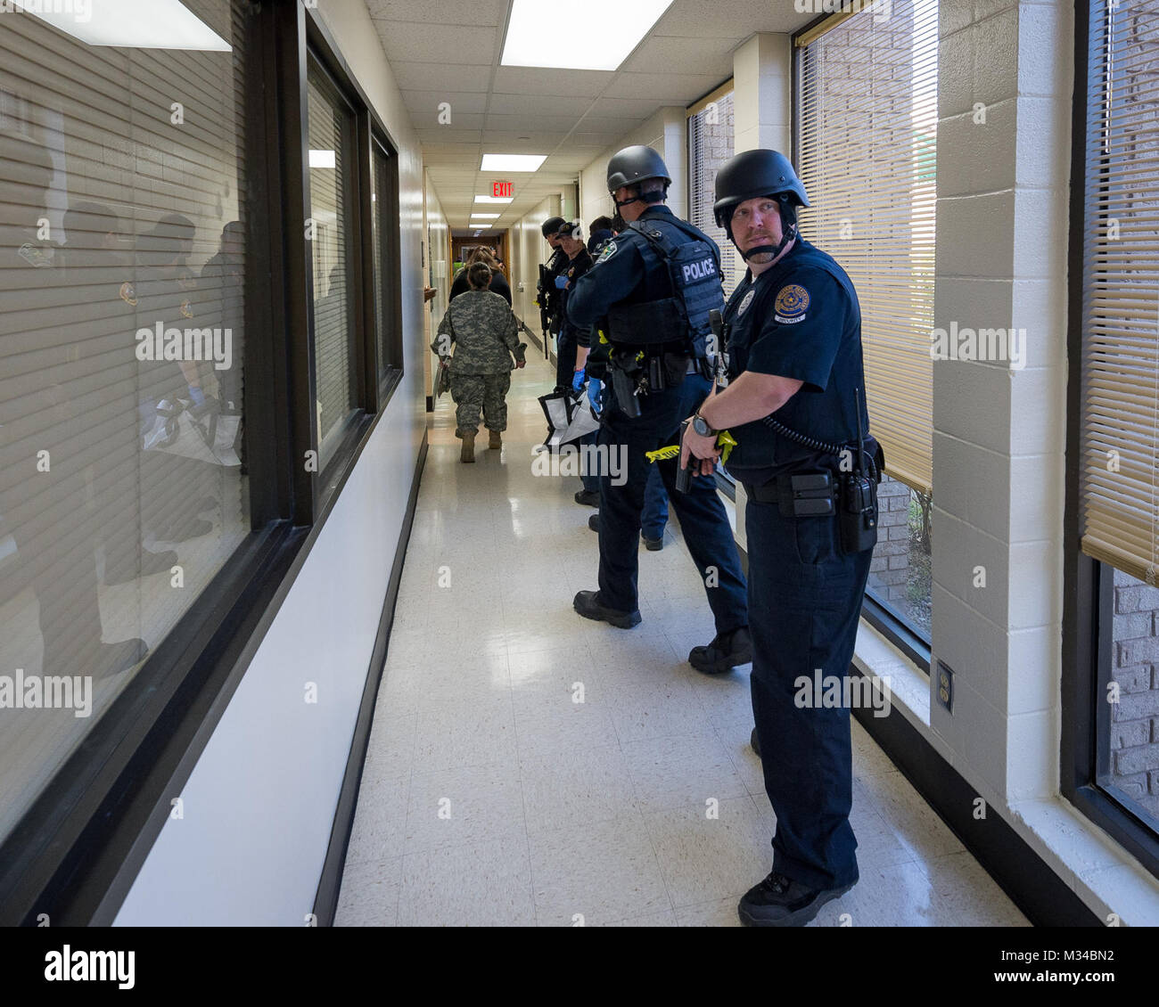 Camp Mabry security officer, John Wessels, helps Austin police officers ...