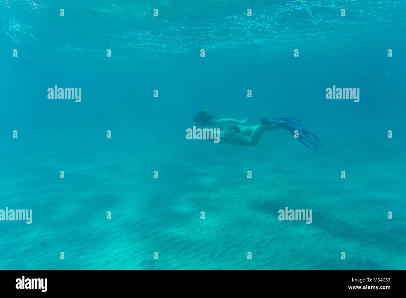 Girl snorkeling in sea hi-res stock photography and images - Alamy