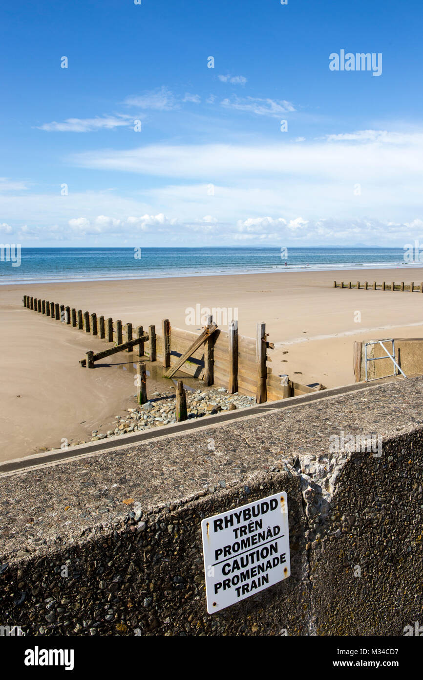 Caution promenade train warning sign in Barmouth Gwynedd North Wales UK ...