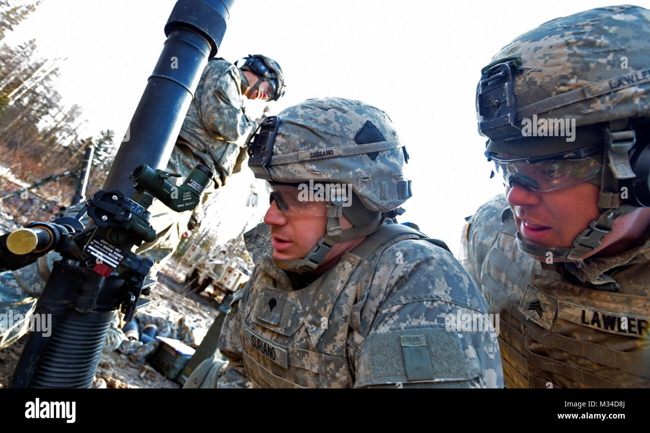 Spc. Dominic Suriano, center, and Army Sgt. Stephen Lawler, both ...