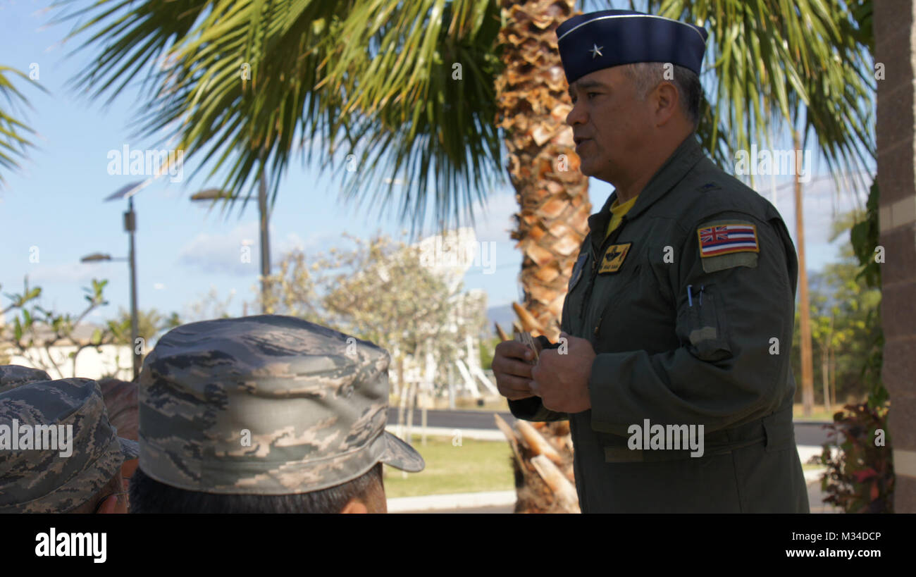 Brig. Gen. Braden Sakai, Commander 154th Wing, reviews the merits of ...