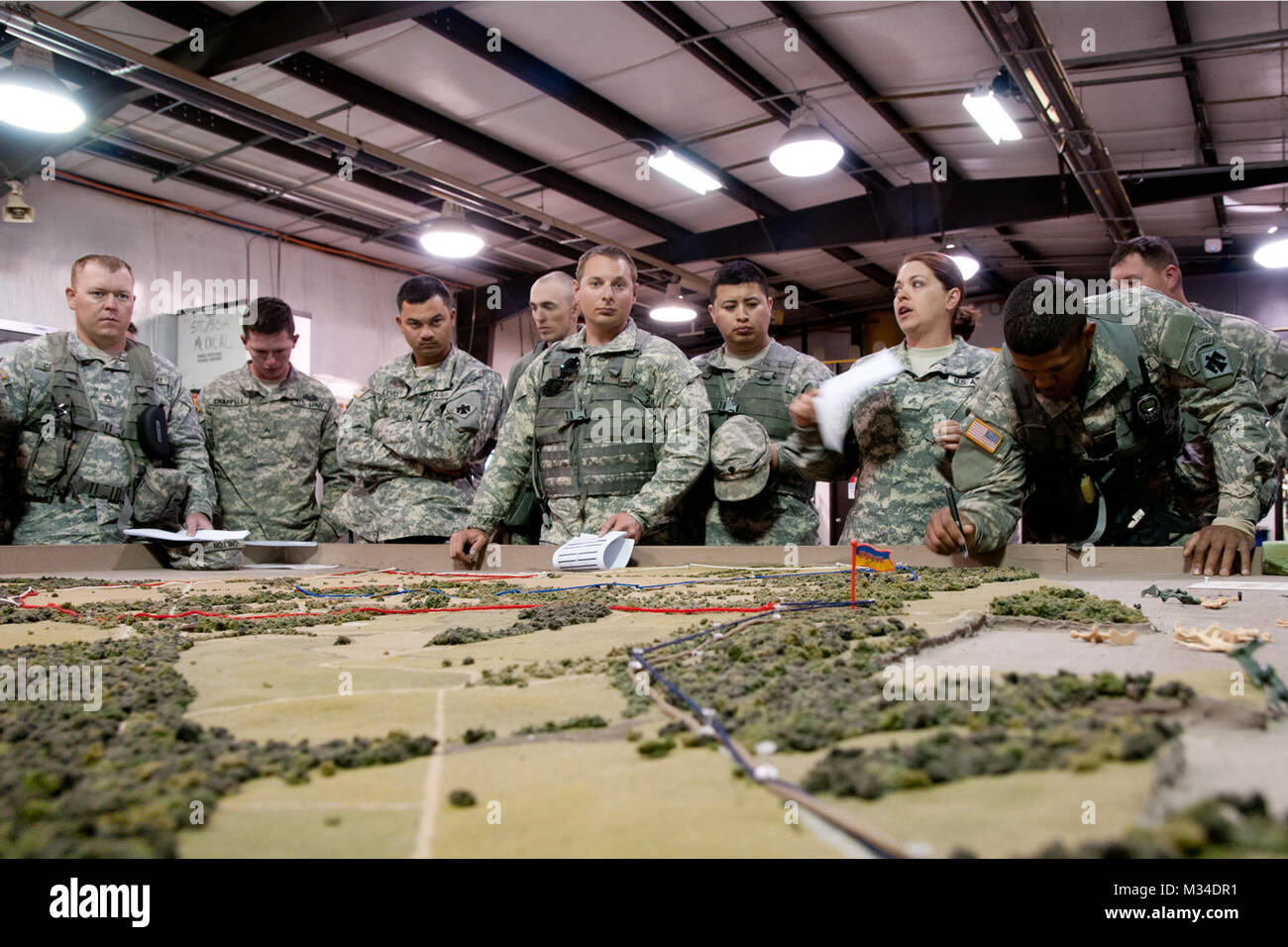 Soldiers from Company A, 700th Brigade Support Battalion, discuss a ...