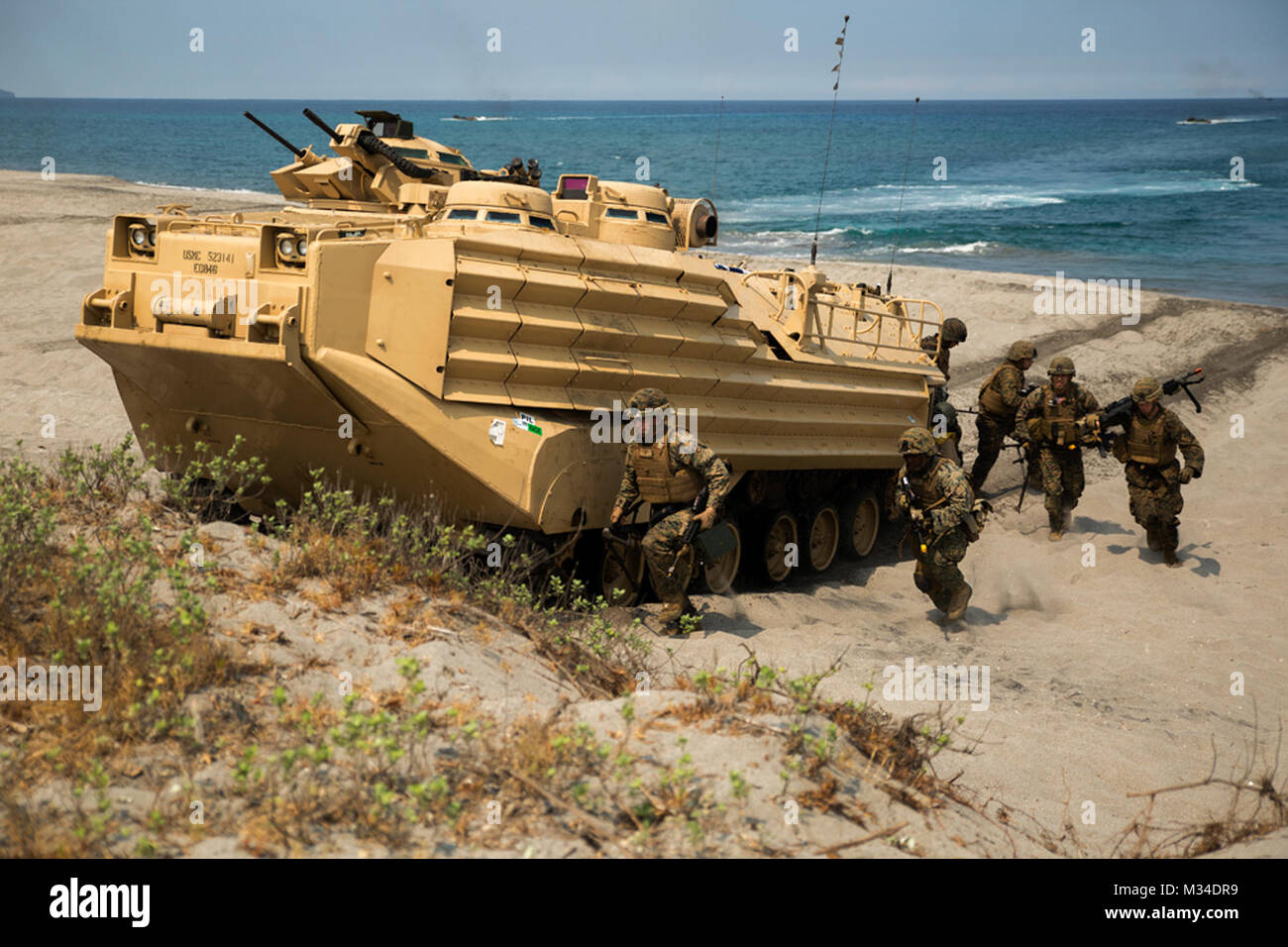 Marines with 3rd Marine Regiment exit an Amphibious Assault Vehicle ...