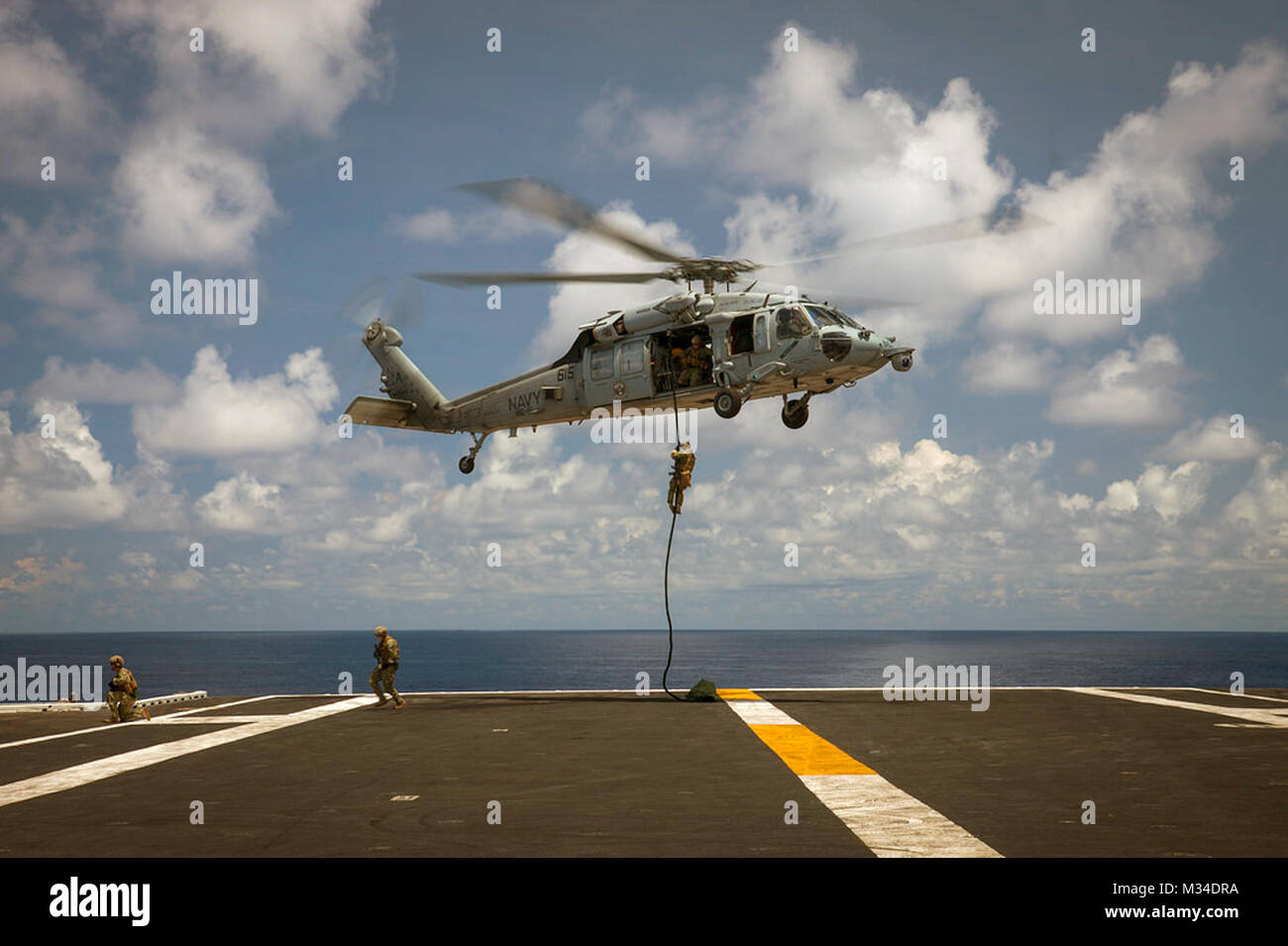 Sailors fast-rope aboard the USS Carl Vinson in the India Ocean by # ...