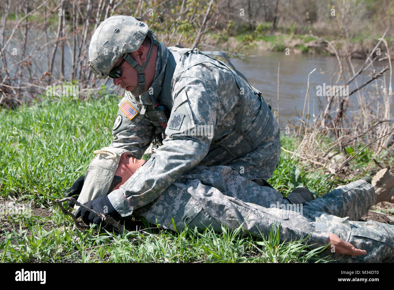 A Soldier from Company A, 700th Brigade Support Battalion, administers ...