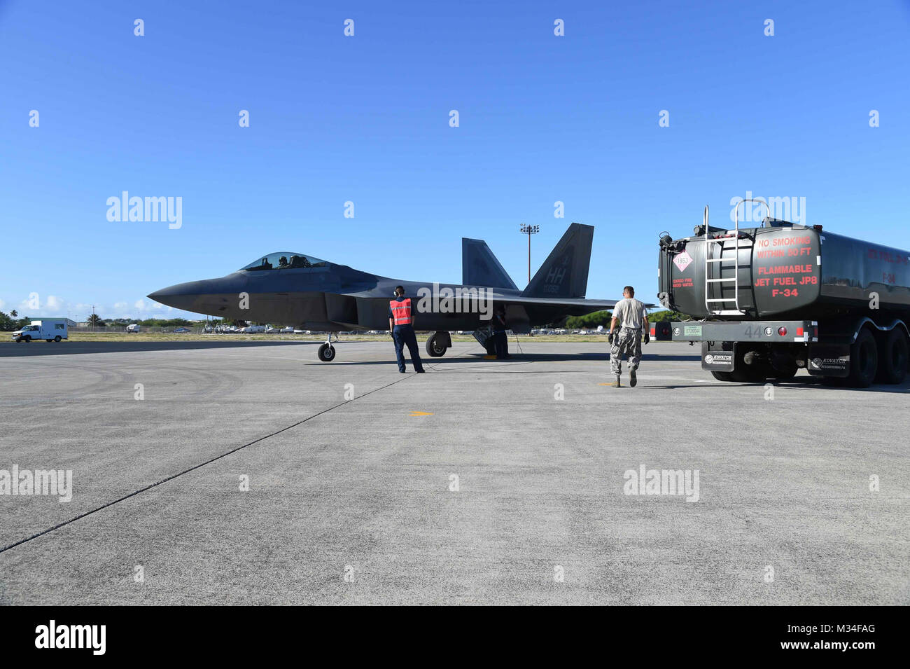 A F-22 Raptor pilot from the 19th Fighter Squadron and maintenance ...