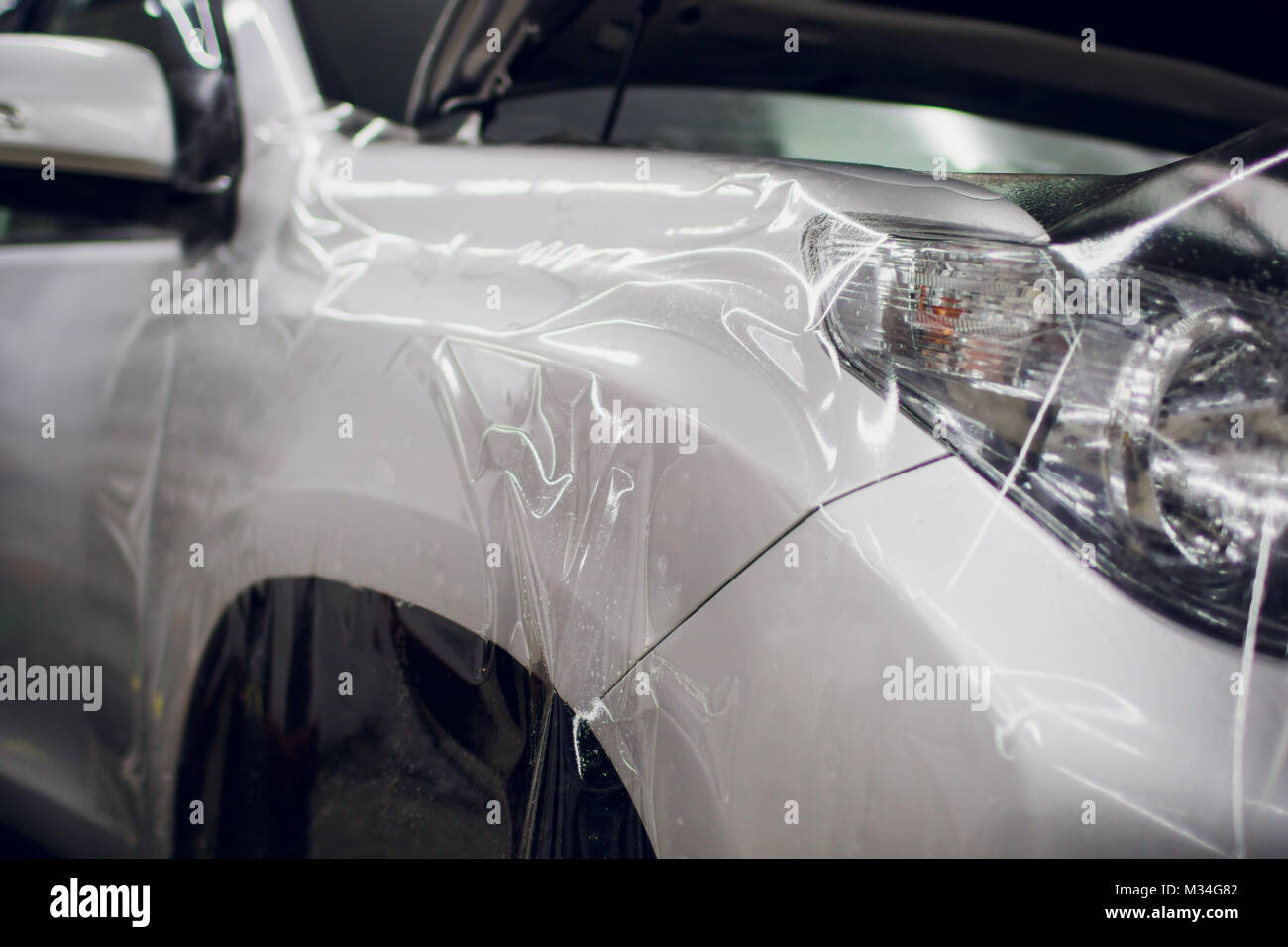 Car paint protection, protect coating installation man Stock Photo - Alamy
