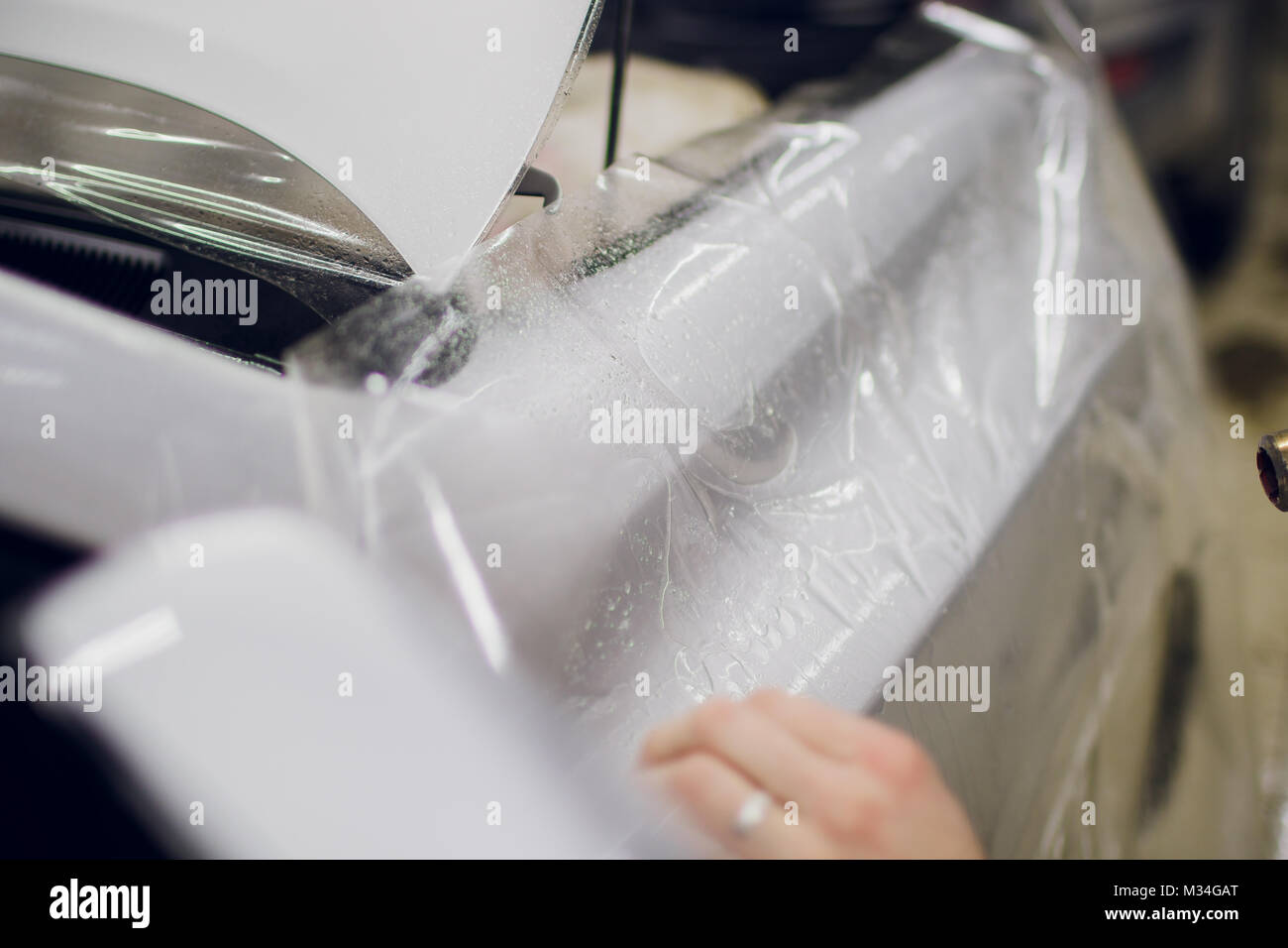 Car paint protection, protect coating installation man Stock Photo - Alamy