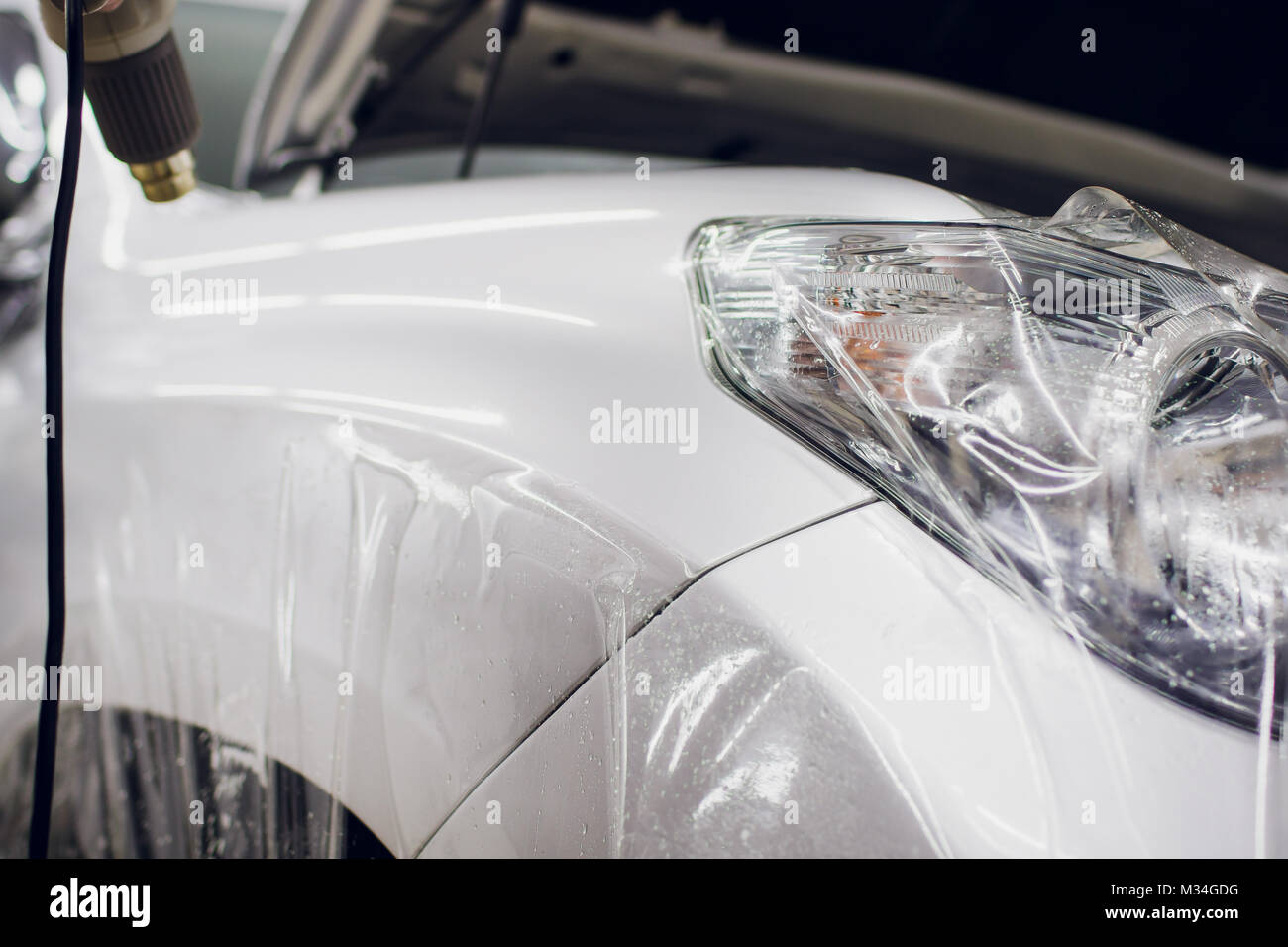Car paint protection, protect coating installation man Stock Photo - Alamy