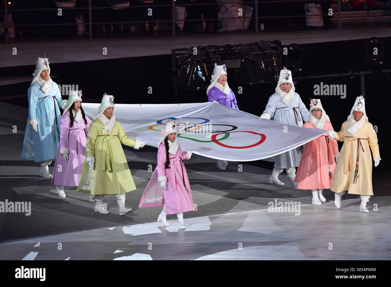 Pyeongchang, South Korea. 9th Feb, 2018. The Olympic flag is carried ...