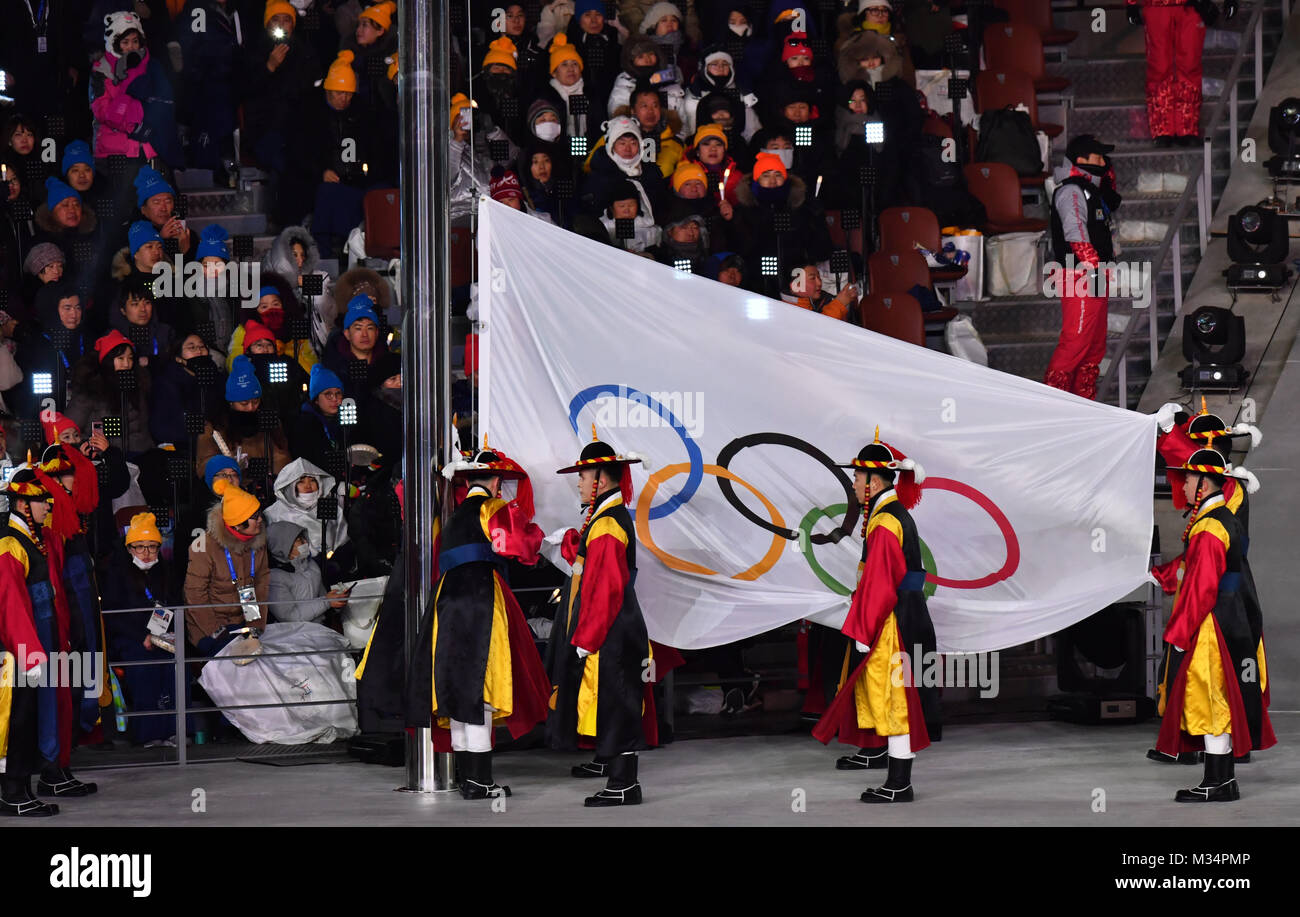 Pyeongchang, South Korea. 9th Feb, 2018. The Olympic flag is raised at ...