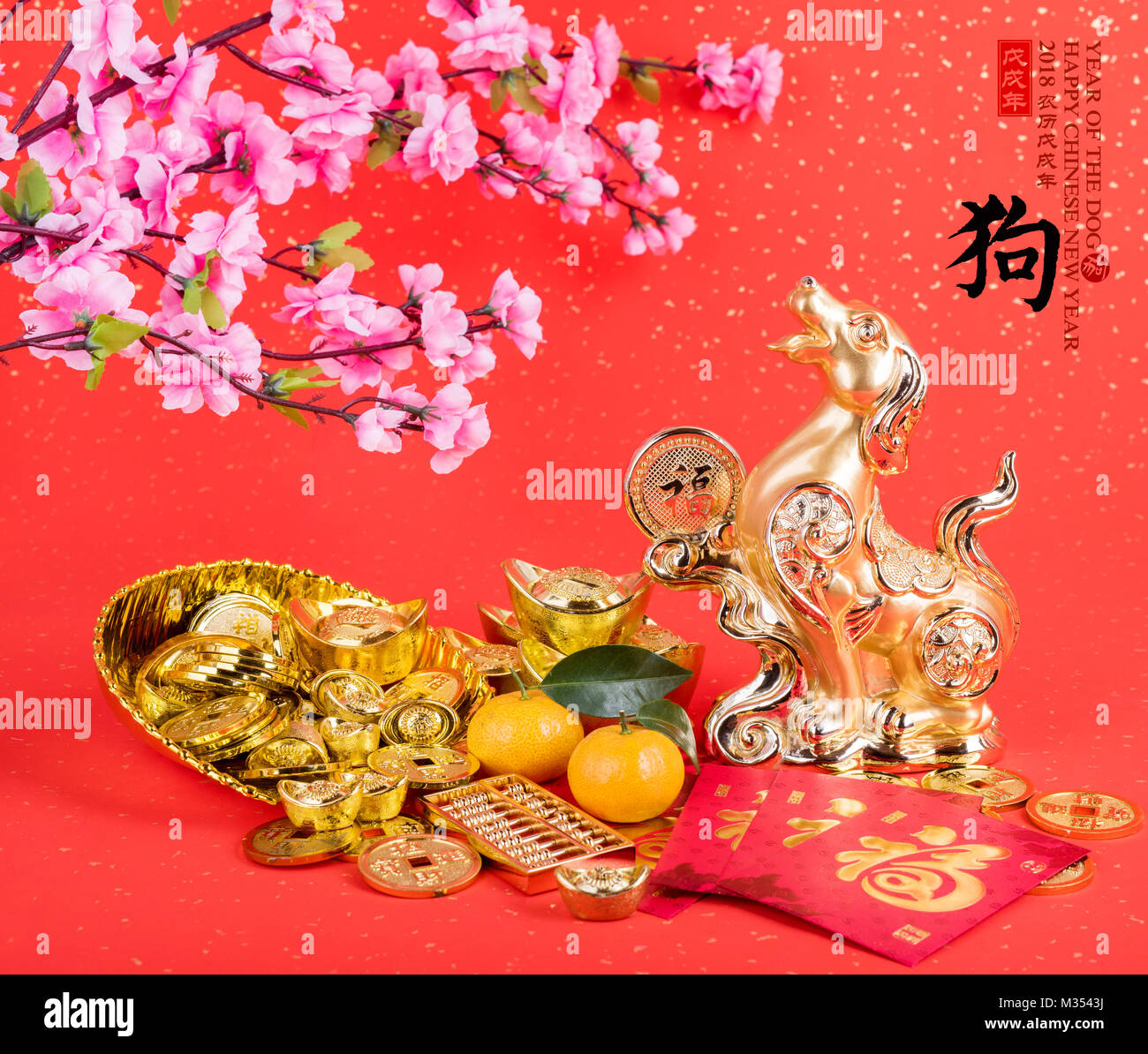 golden dog statue on red paper,translation of calligraphy: good Fortune ...