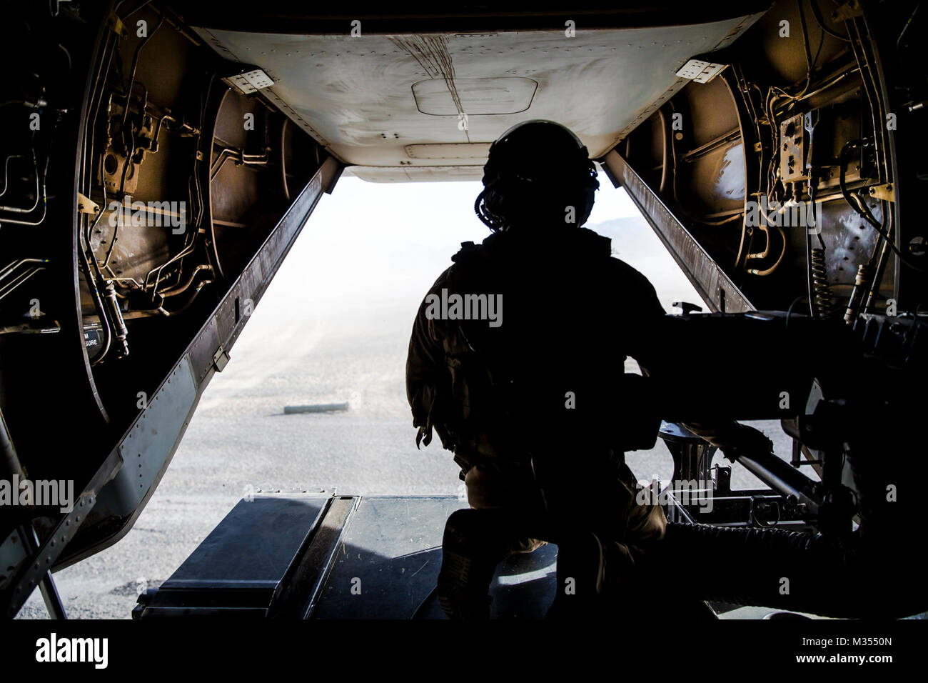 A Marine with Marine Wing Support Squadron 371 scans the skies in an MV ...