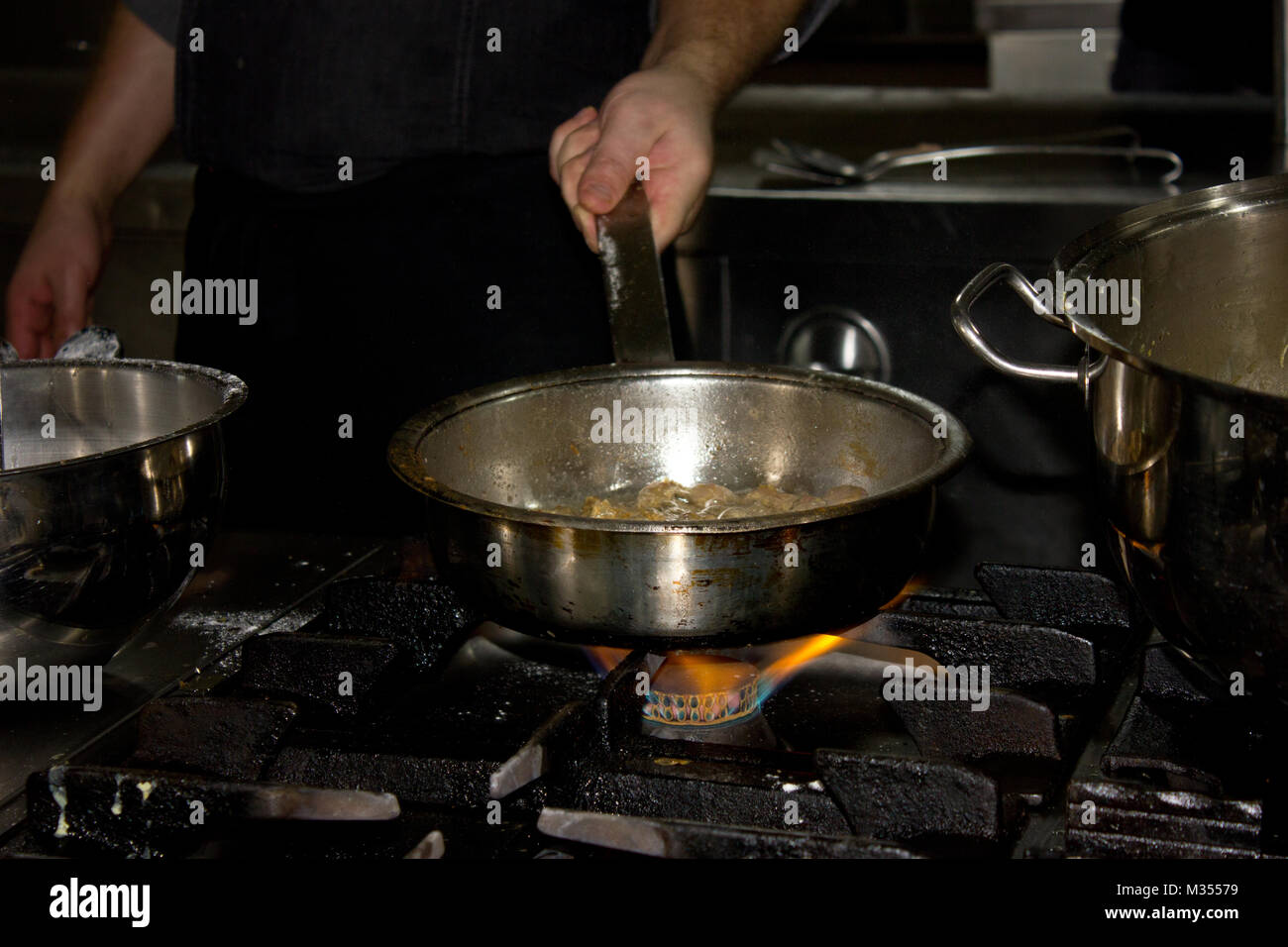 Gas fire hands young hi-res stock photography and images - Alamy