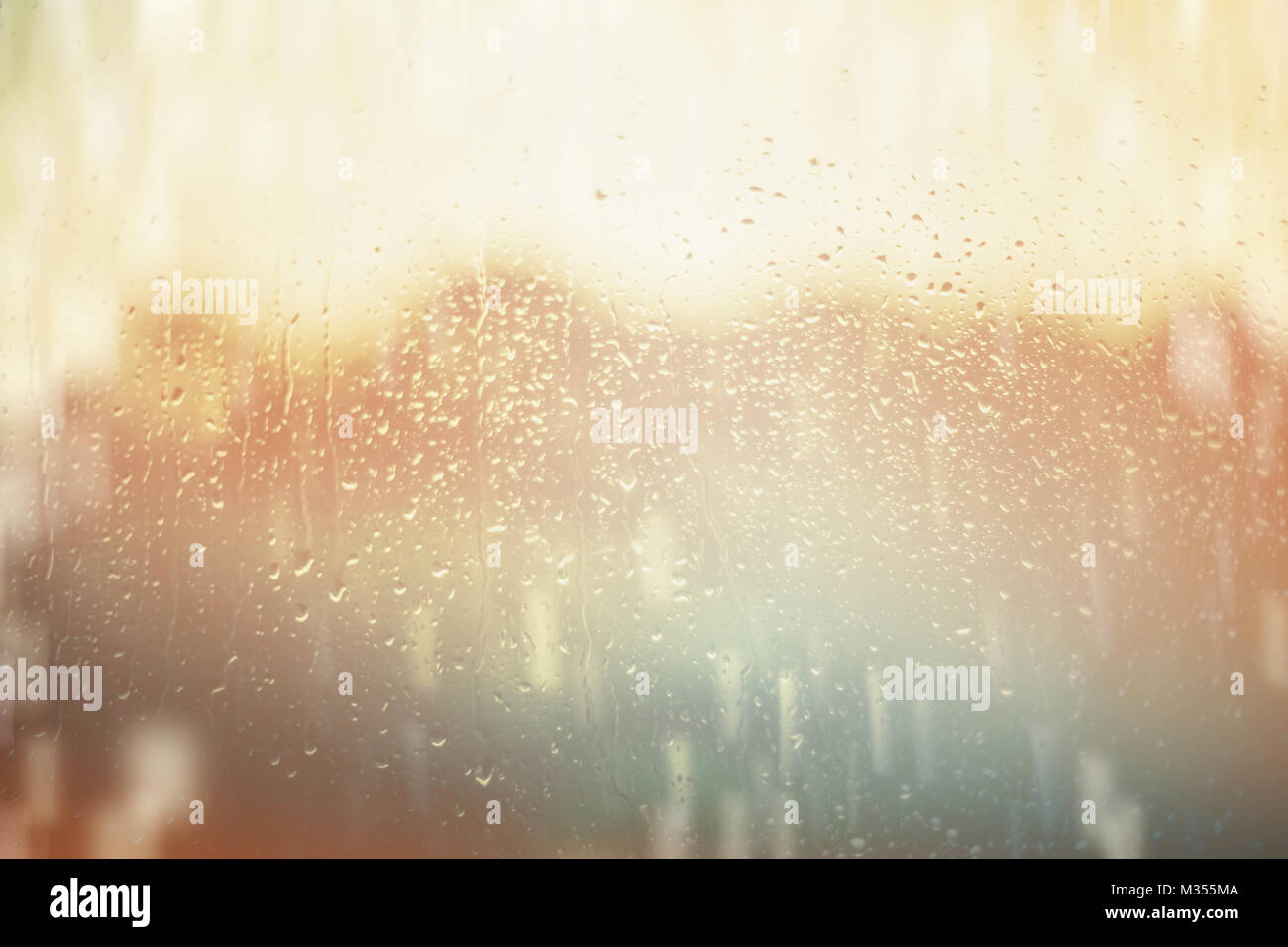 Sunny rain water drops on window glass background Stock Photo - Alamy