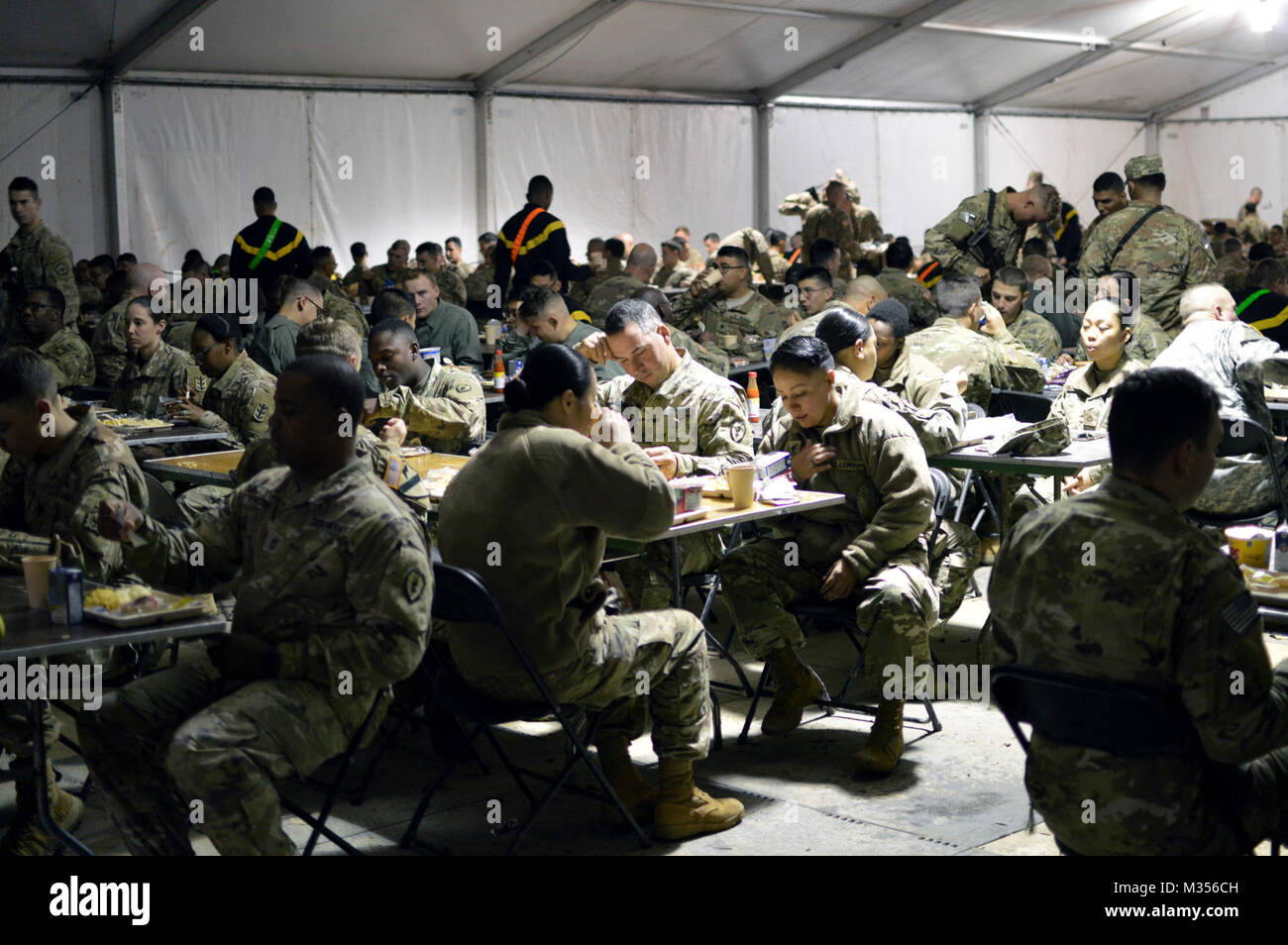 Soldiers eating breakfast served up by culinary specialist assigned to ...