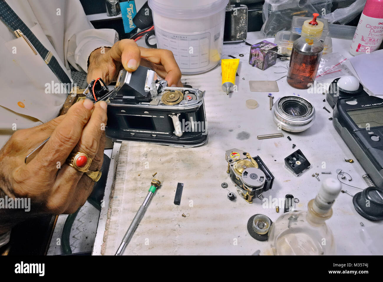 man repairing film camera, India, Asia Stock Photo - Alamy