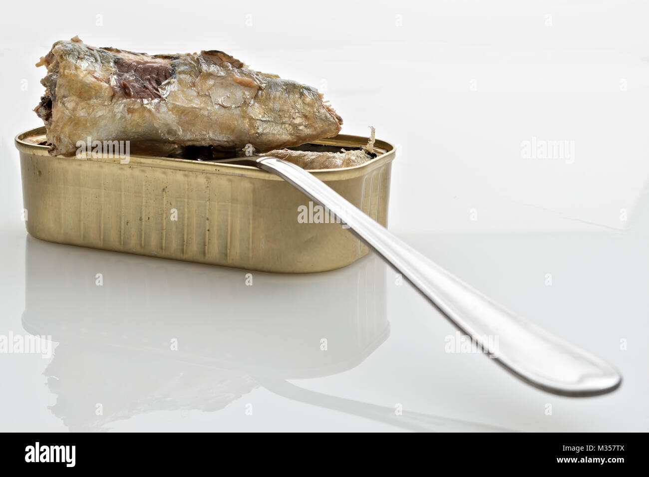 sardine box with fork from below Stock Photo - Alamy