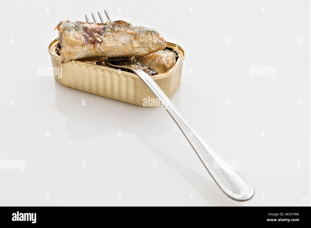 sardine box with fork from above 2 Stock Photo - Alamy