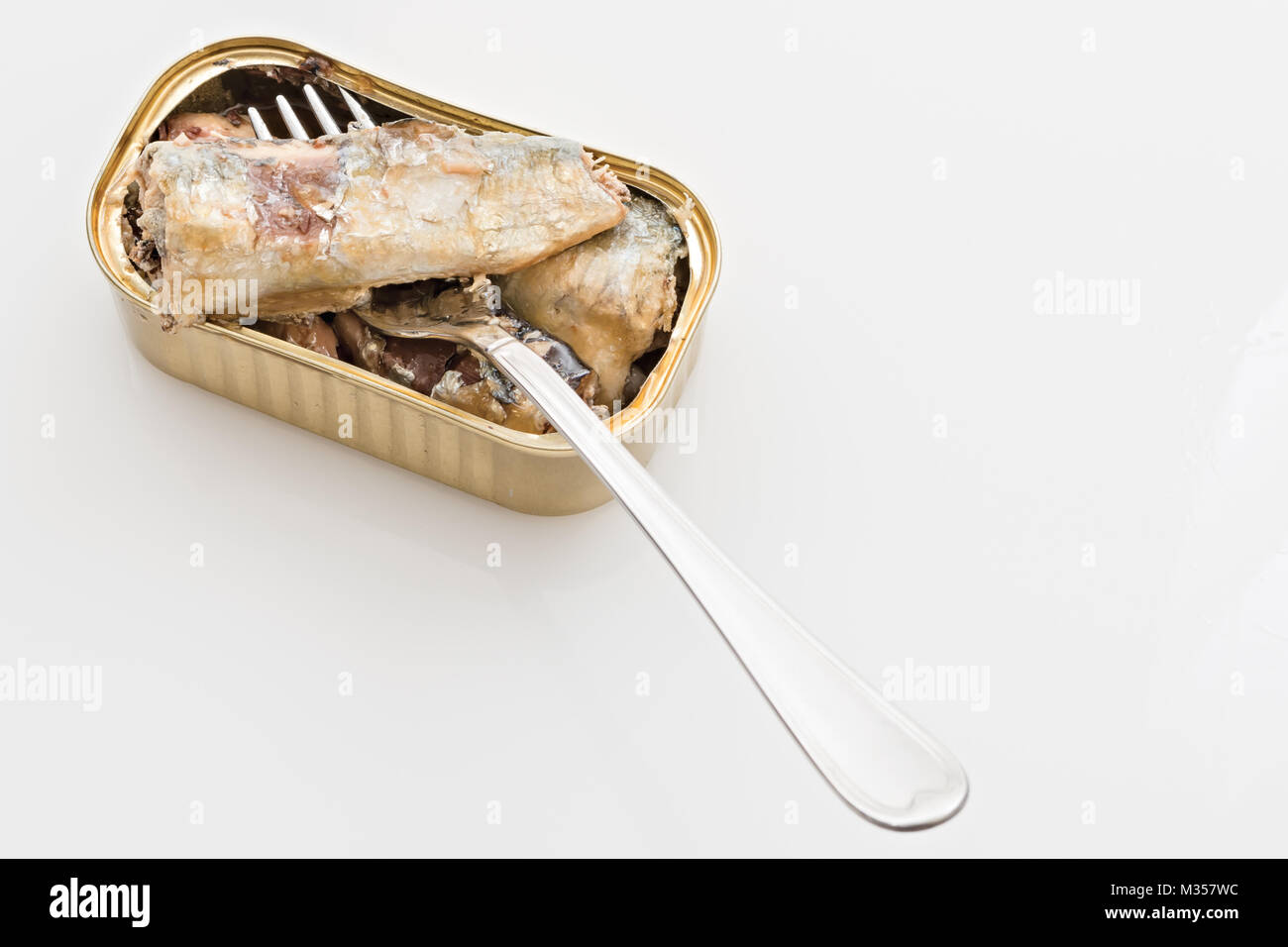 sardine box with fork from above 3 Stock Photo - Alamy