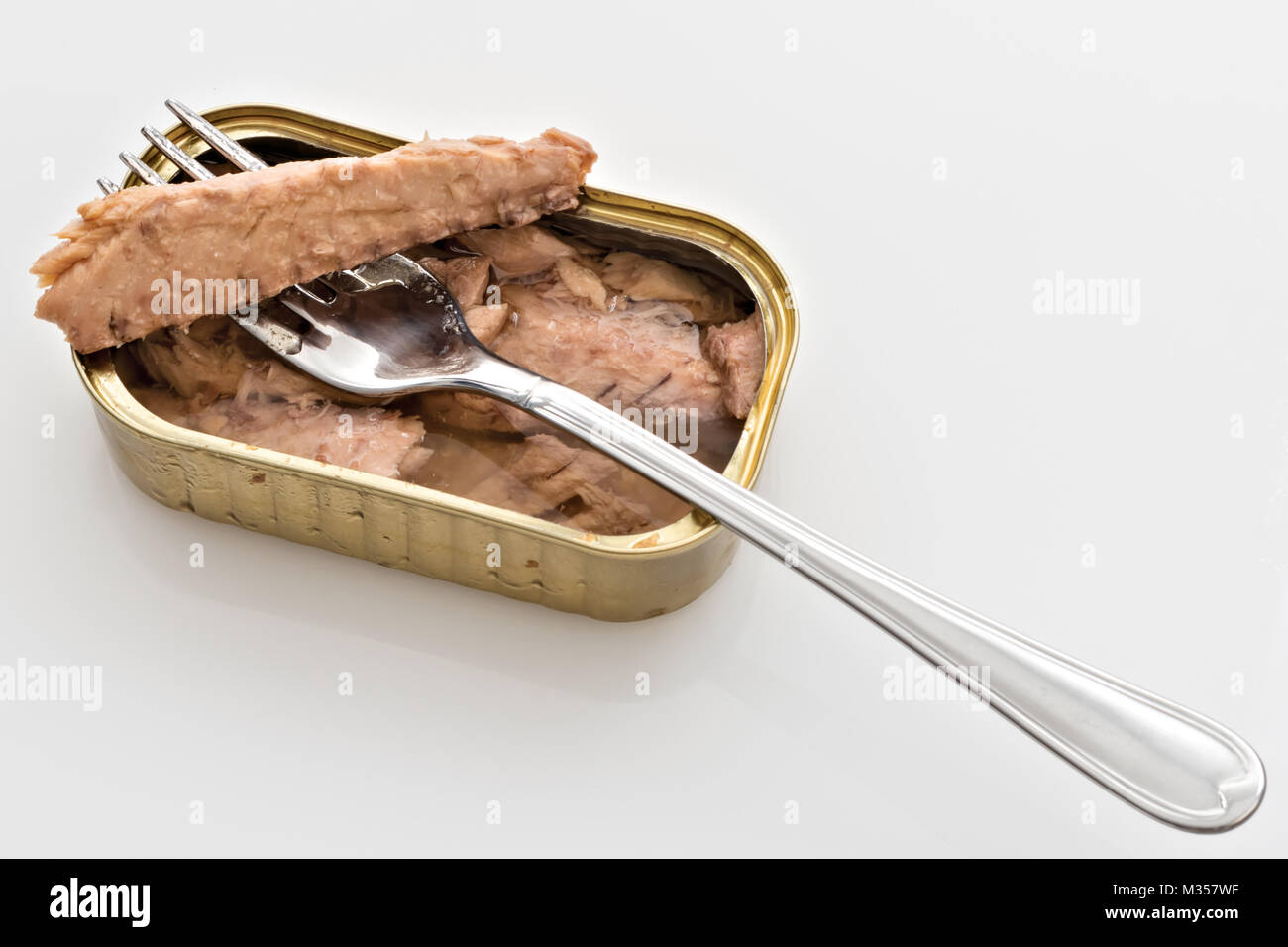 mackerel box with fork from above Stock Photo - Alamy