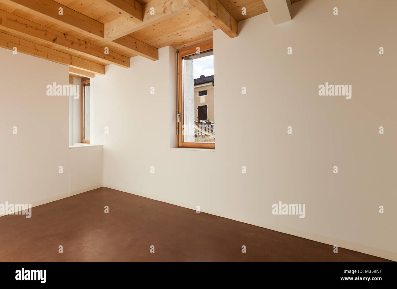comfortable empty loft, interior, room with windows Stock Photo - Alamy
