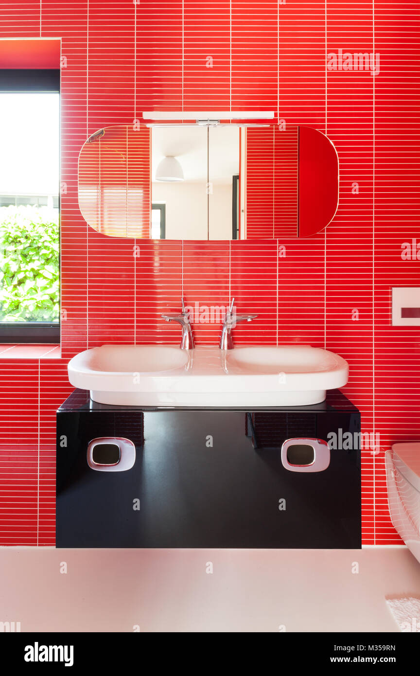 interior of a modern house, red bathroom Stock Photo - Alamy