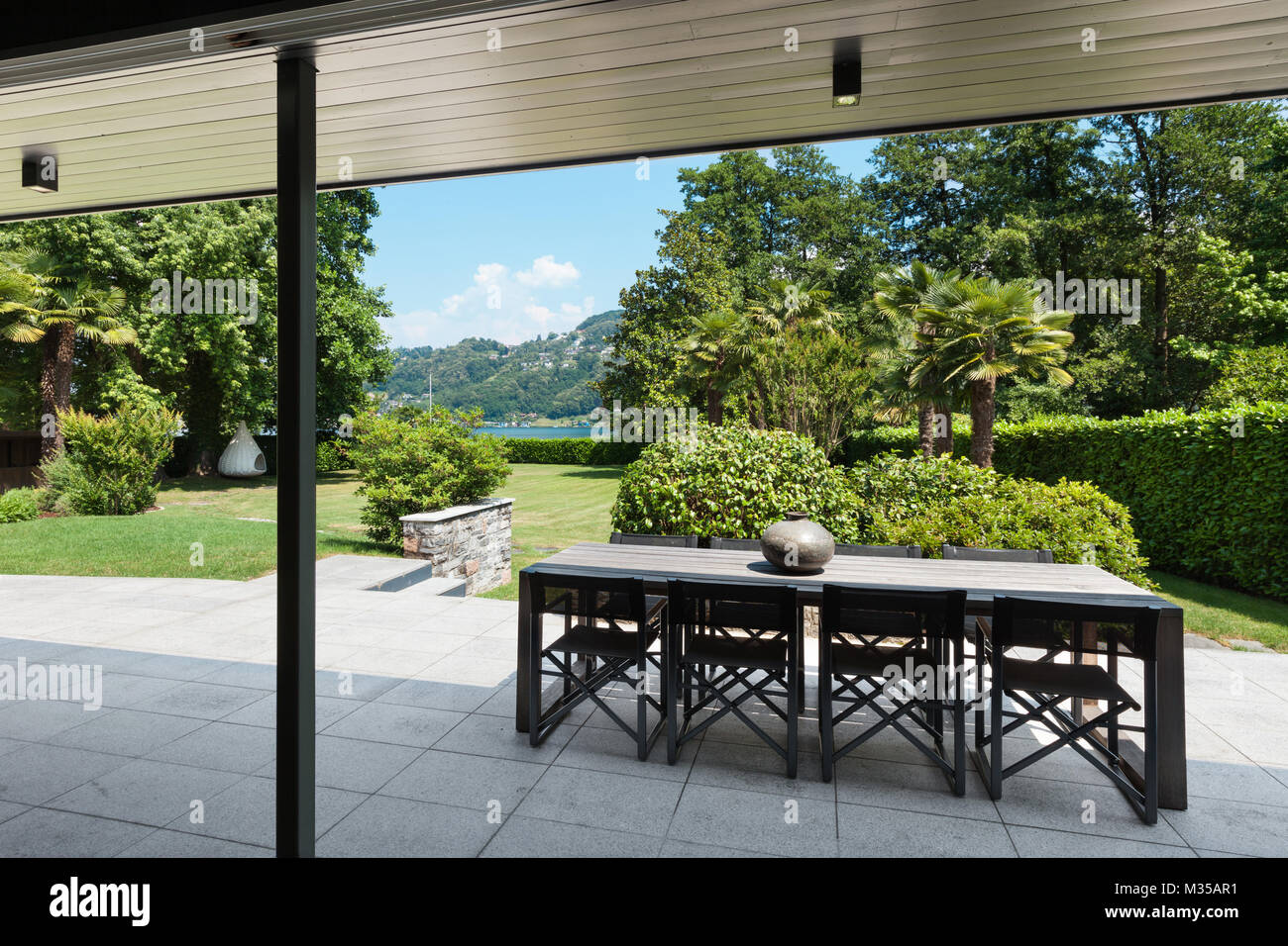 patio of a villa, modern furniture, outdoor Stock Photo - Alamy