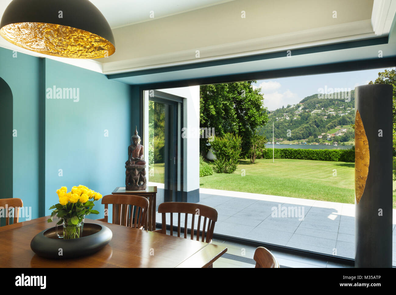 Interior, modern house, dining room, veranda view Stock Photo - Alamy