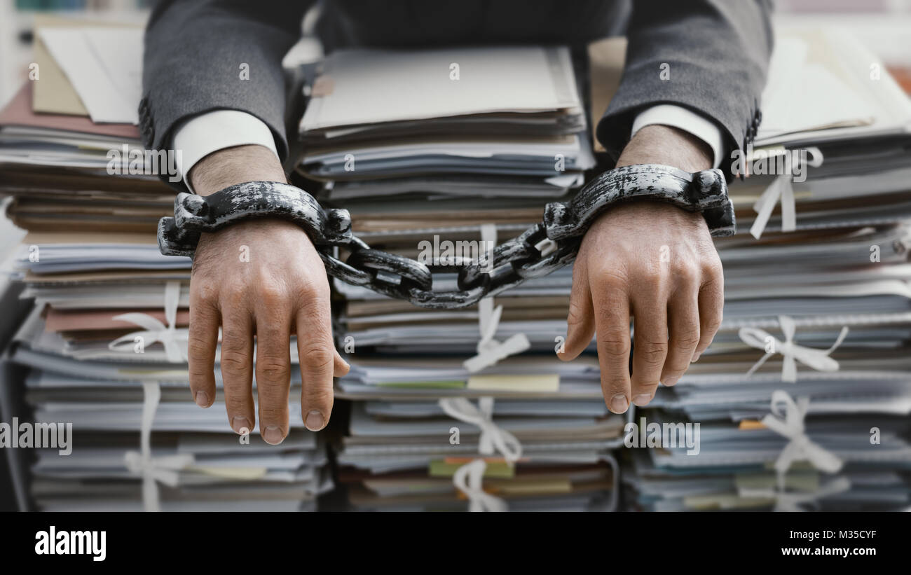 Man chained office hi-res stock photography and images - Alamy