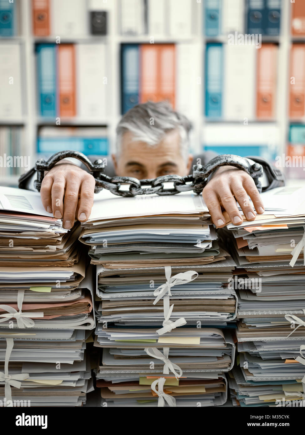 Chained to desk hi-res stock photography and images - Alamy