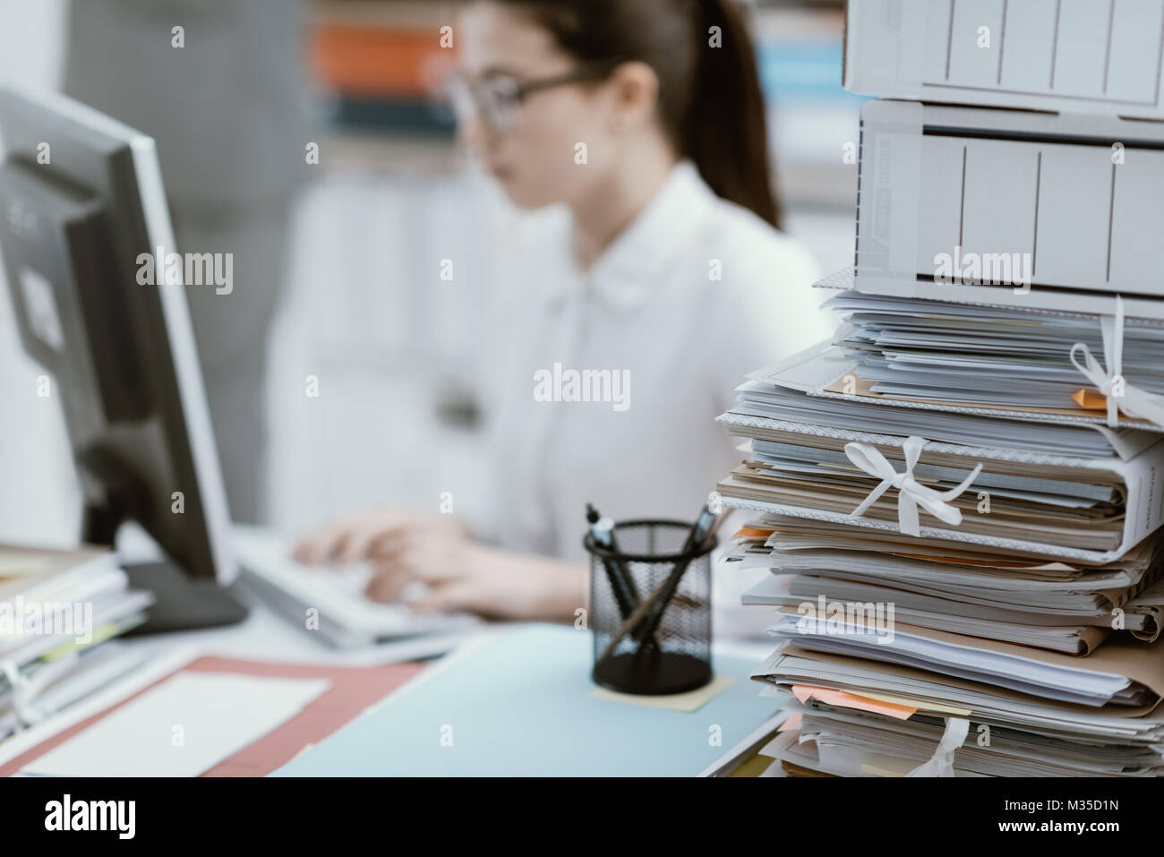 Secretary typing paperwork hi-res stock photography and images - Alamy