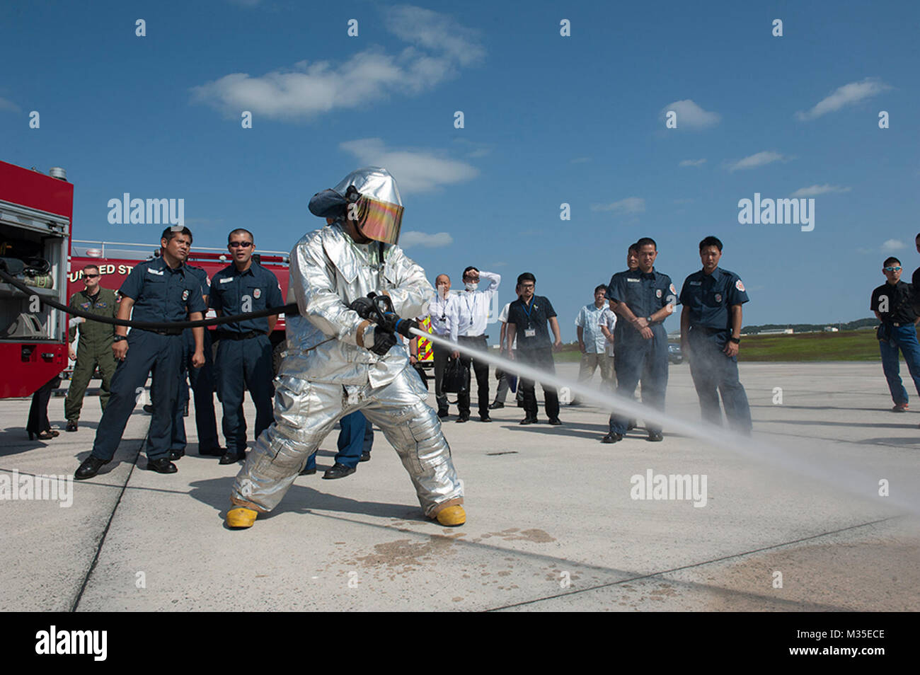 Hideo Shinya, 18th Civil Engineer Squadron firefighter, demonstrates ...