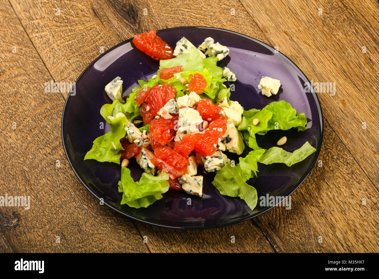 Grapefruit and blue cheese salad with cedar nut Stock Photo - Alamy