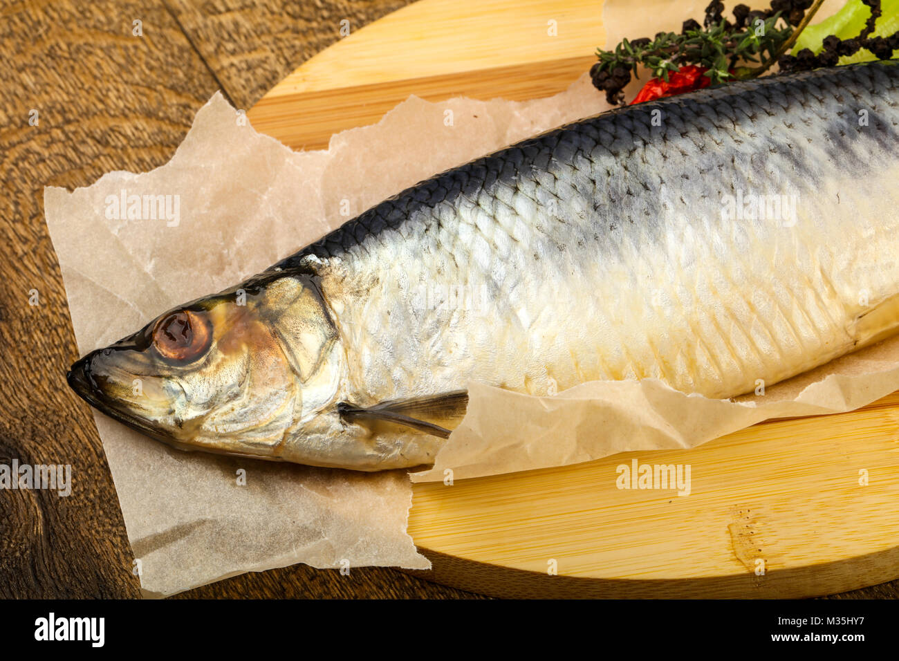 Salted Herring fish with pepper and spices Stock Photo - Alamy