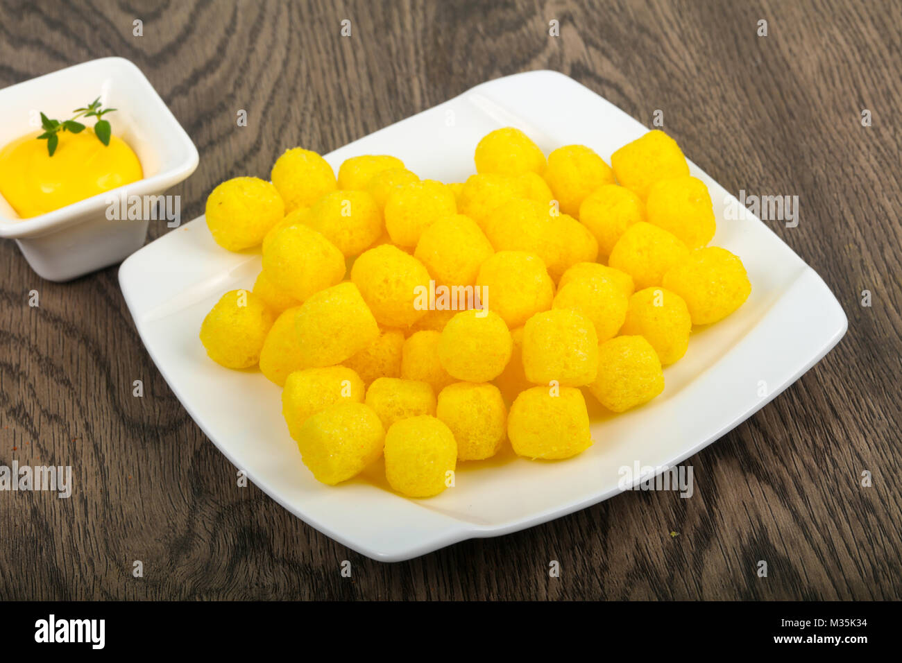 Cheese corn balls with sauce Stock Photo - Alamy