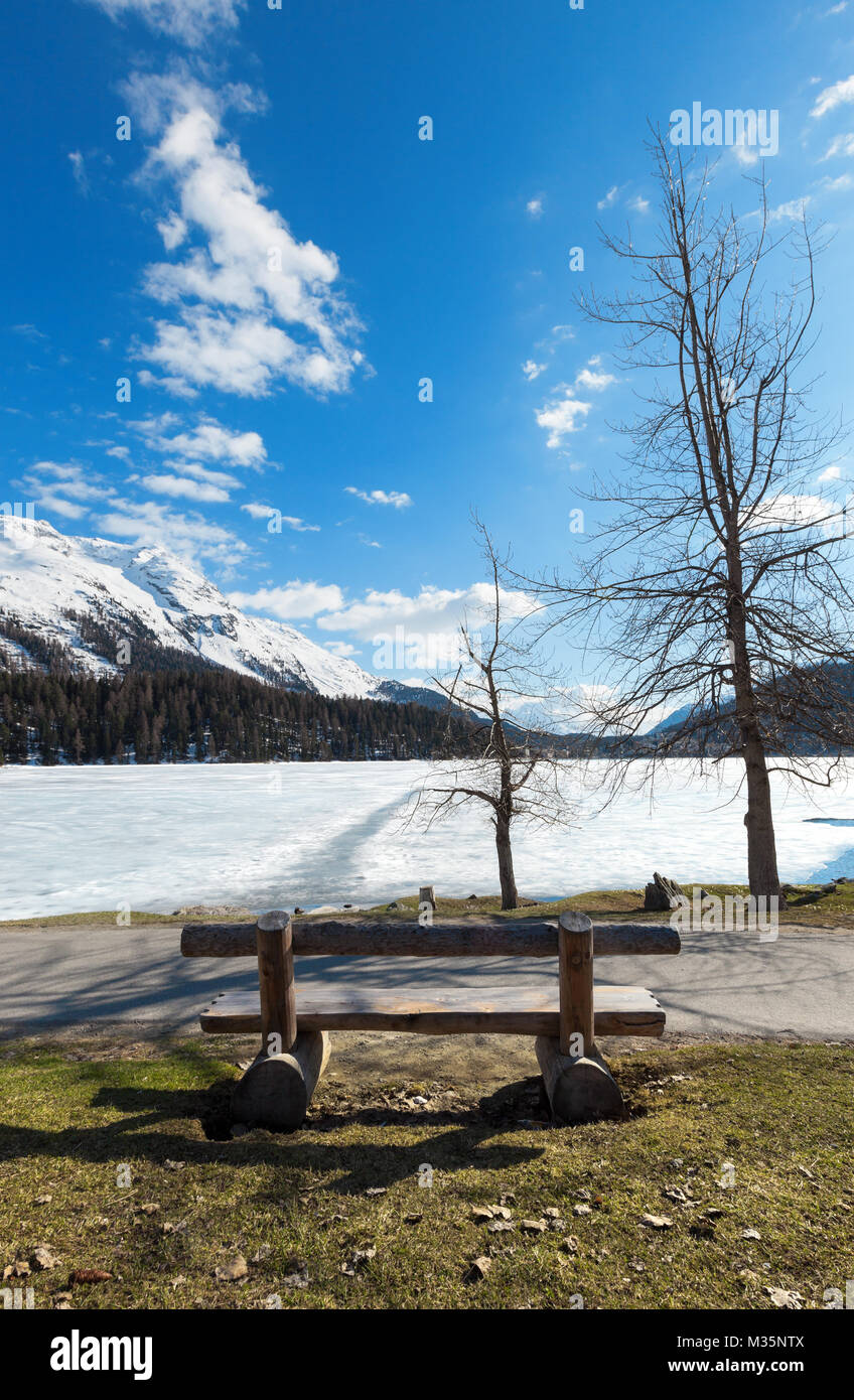 beautiful mountain landscape, lake ice, wooden bench Stock Photo - Alamy