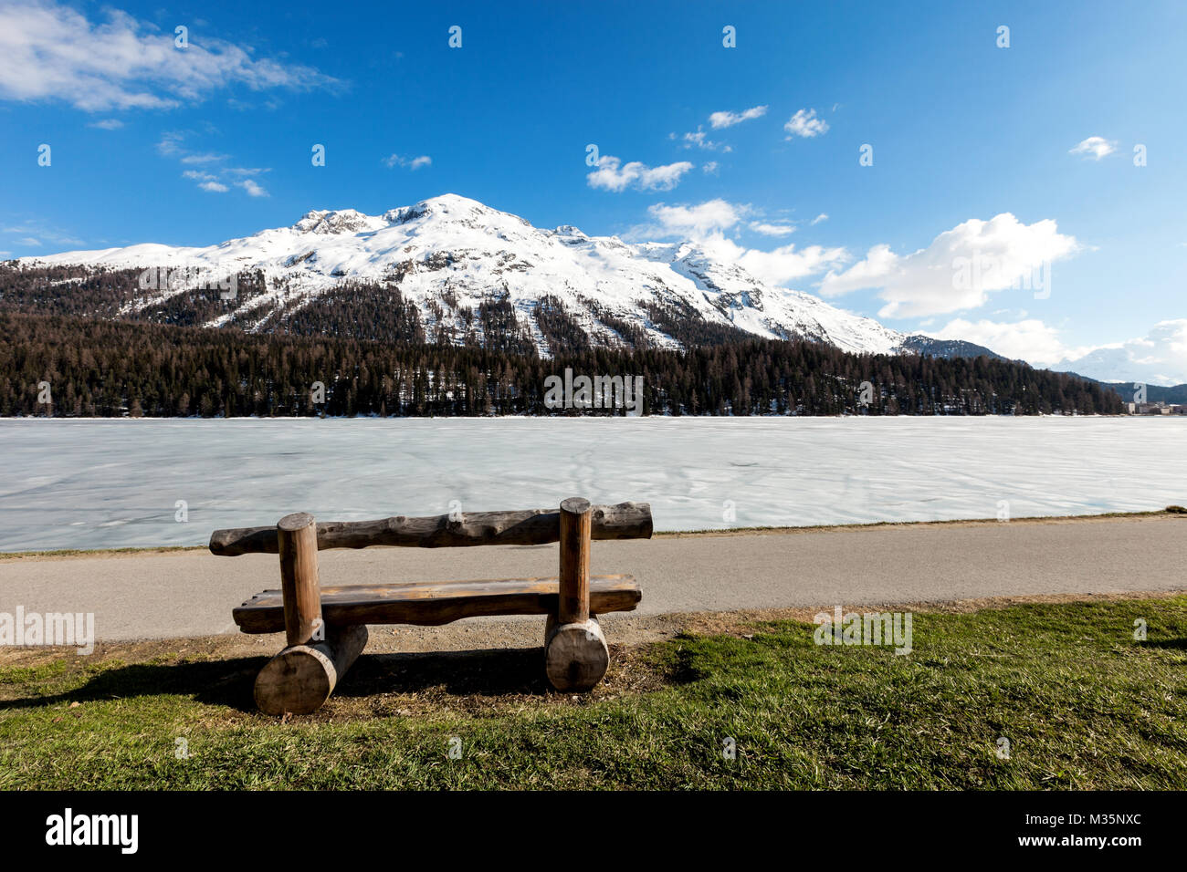 beautiful mountain landscape, lake ice, wooden bench Stock Photo - Alamy