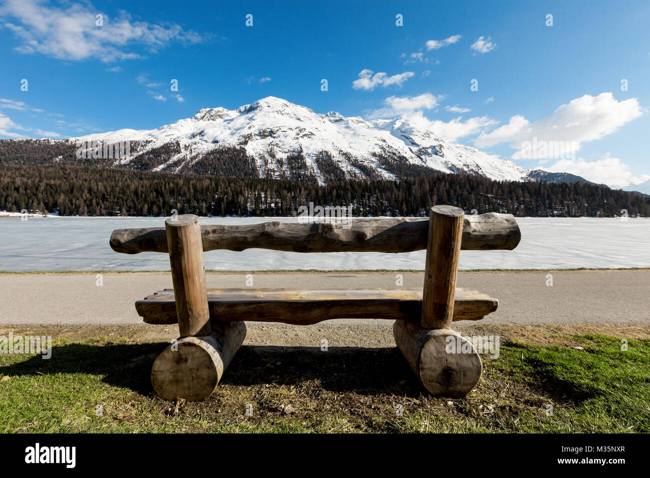 beautiful mountain landscape, lake ice, wooden bench Stock Photo - Alamy