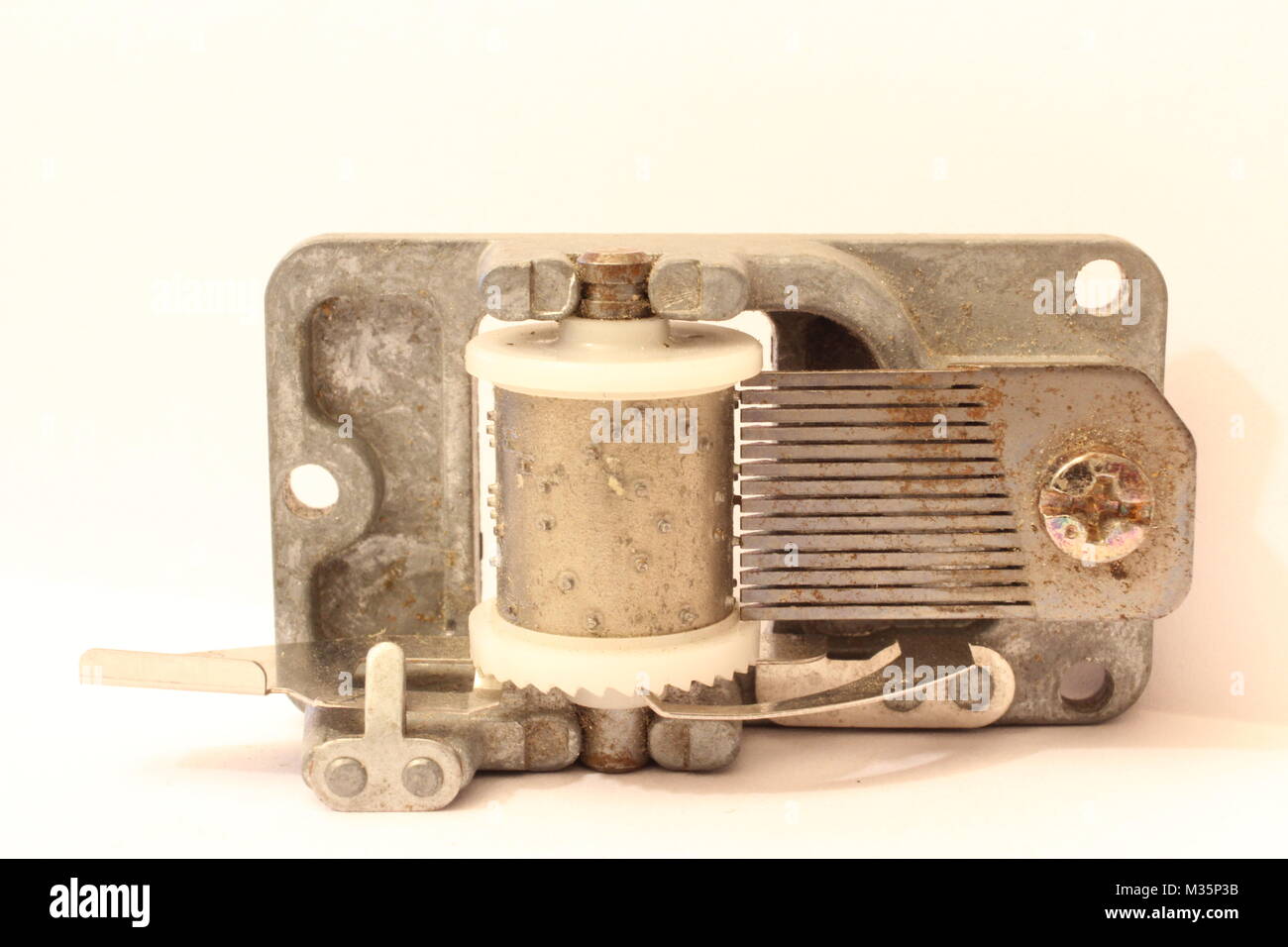 Old rusty music mechanism from a music box Stock Photo - Alamy